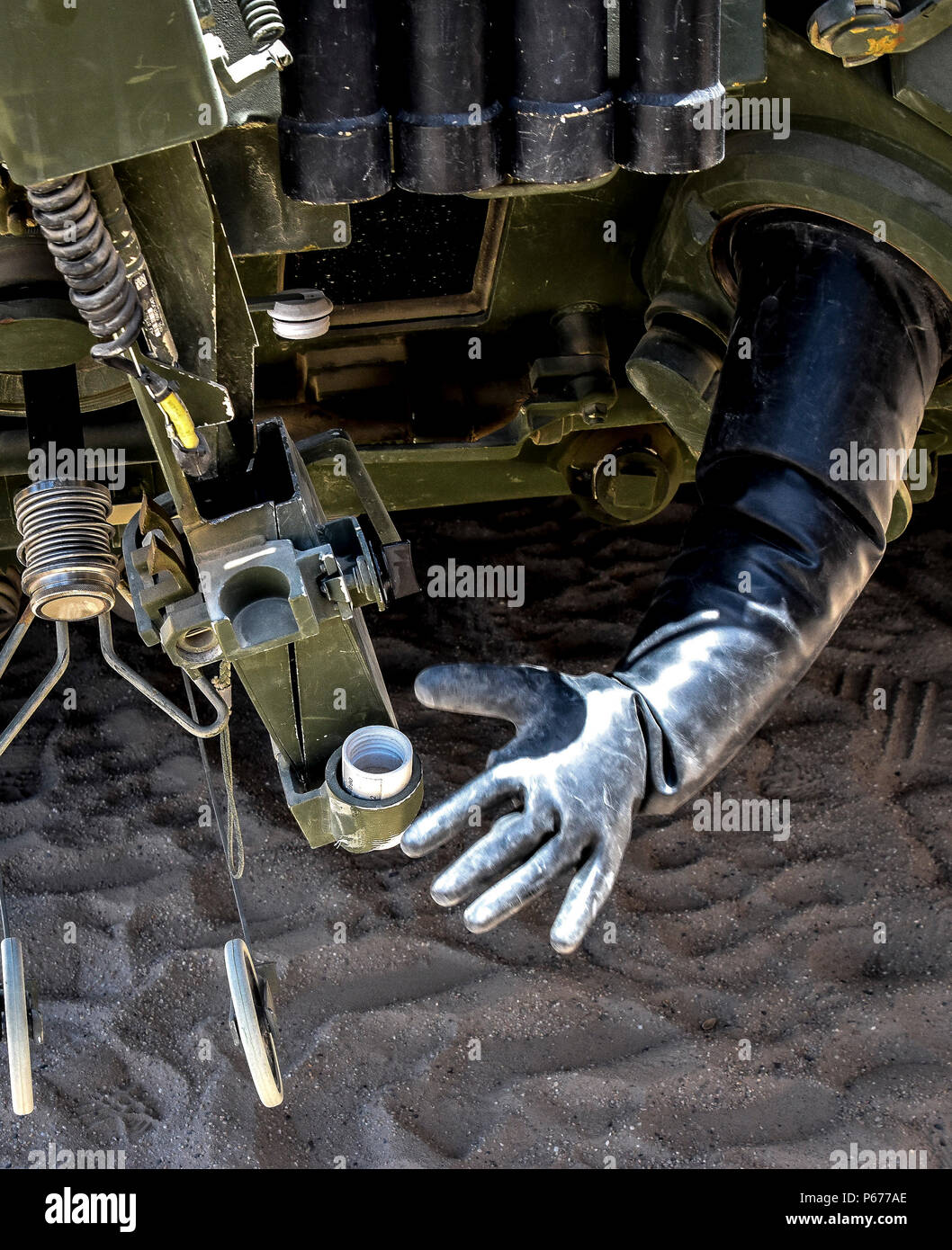 A U.S. Army Reserve soldier with the 369th Chemical Company collects a ...