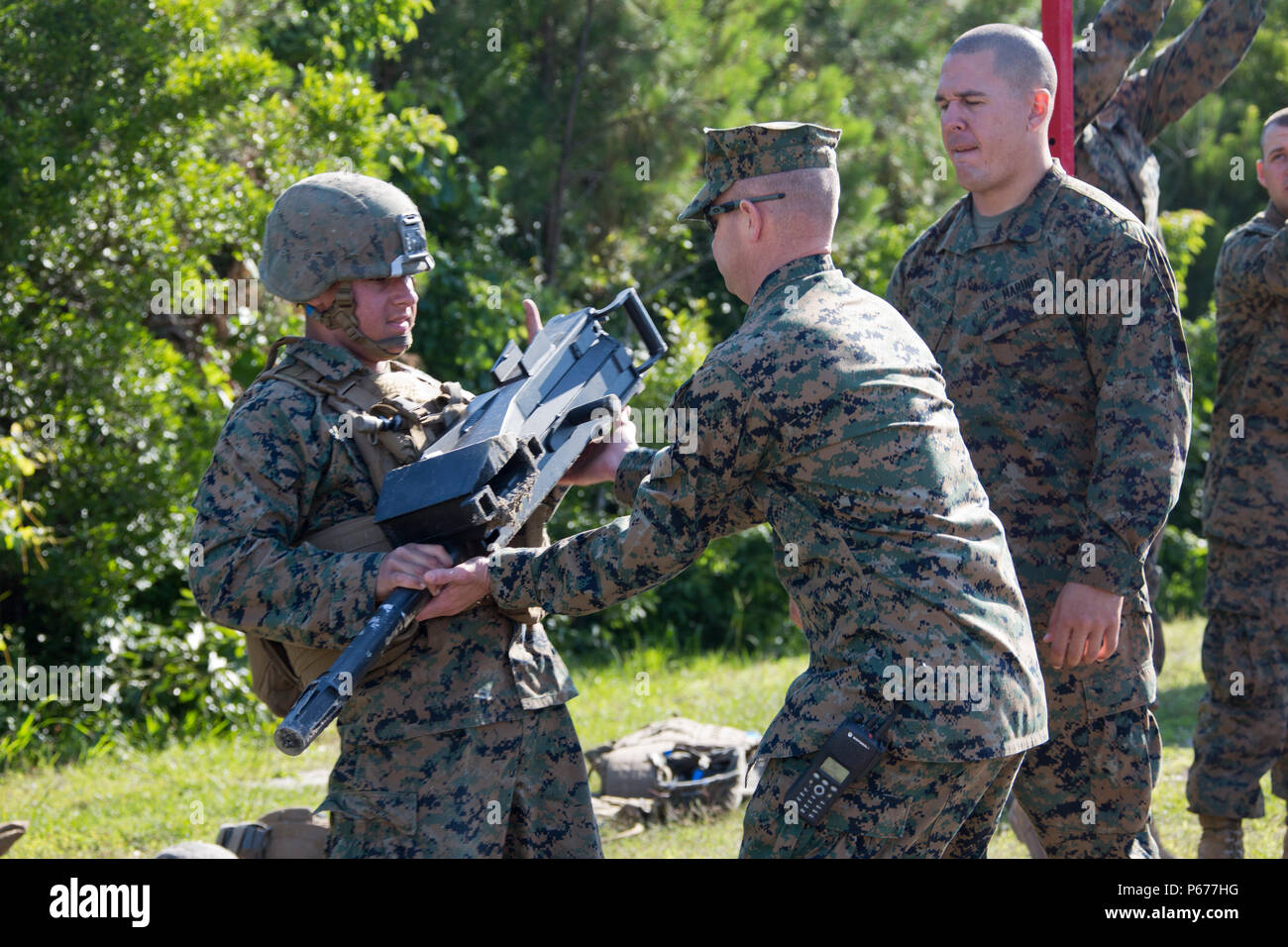 U.S. Marine Corps Gunnery Sgt. Don E. Turner, Jr., center, the Alpha ...