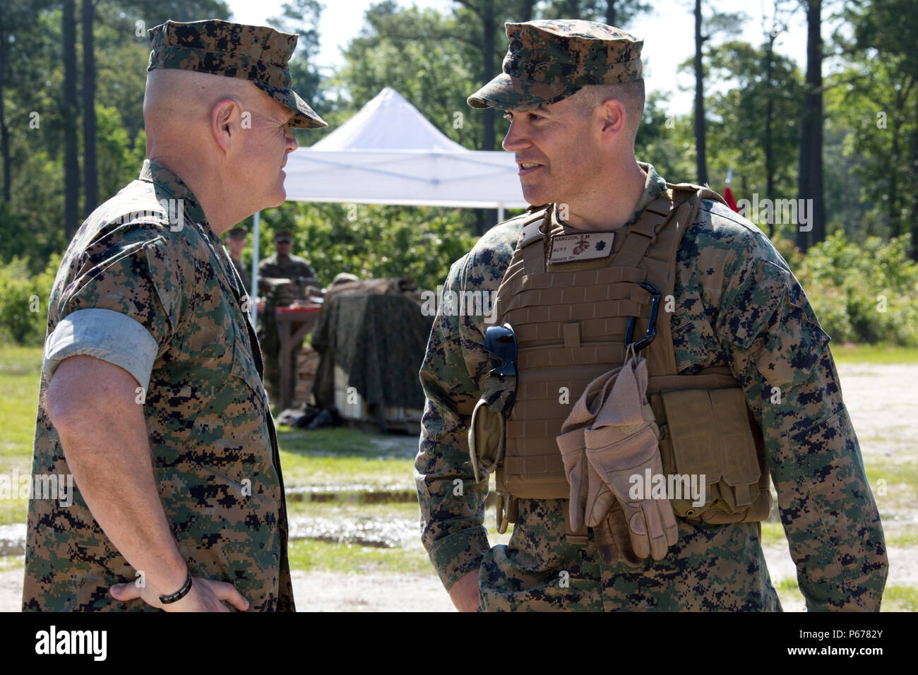 Commandant of the Marine Corps, Gen. Robert B. Neller, right, interacts ...