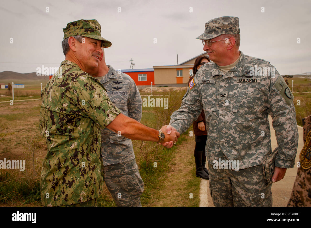 U.S. Navy Adm. Harry B. Harris, commander, U.S. Pacific Command, greets ...