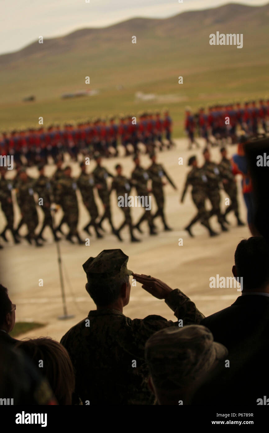 A multinational formation of troops conduct a pass in review during the ...