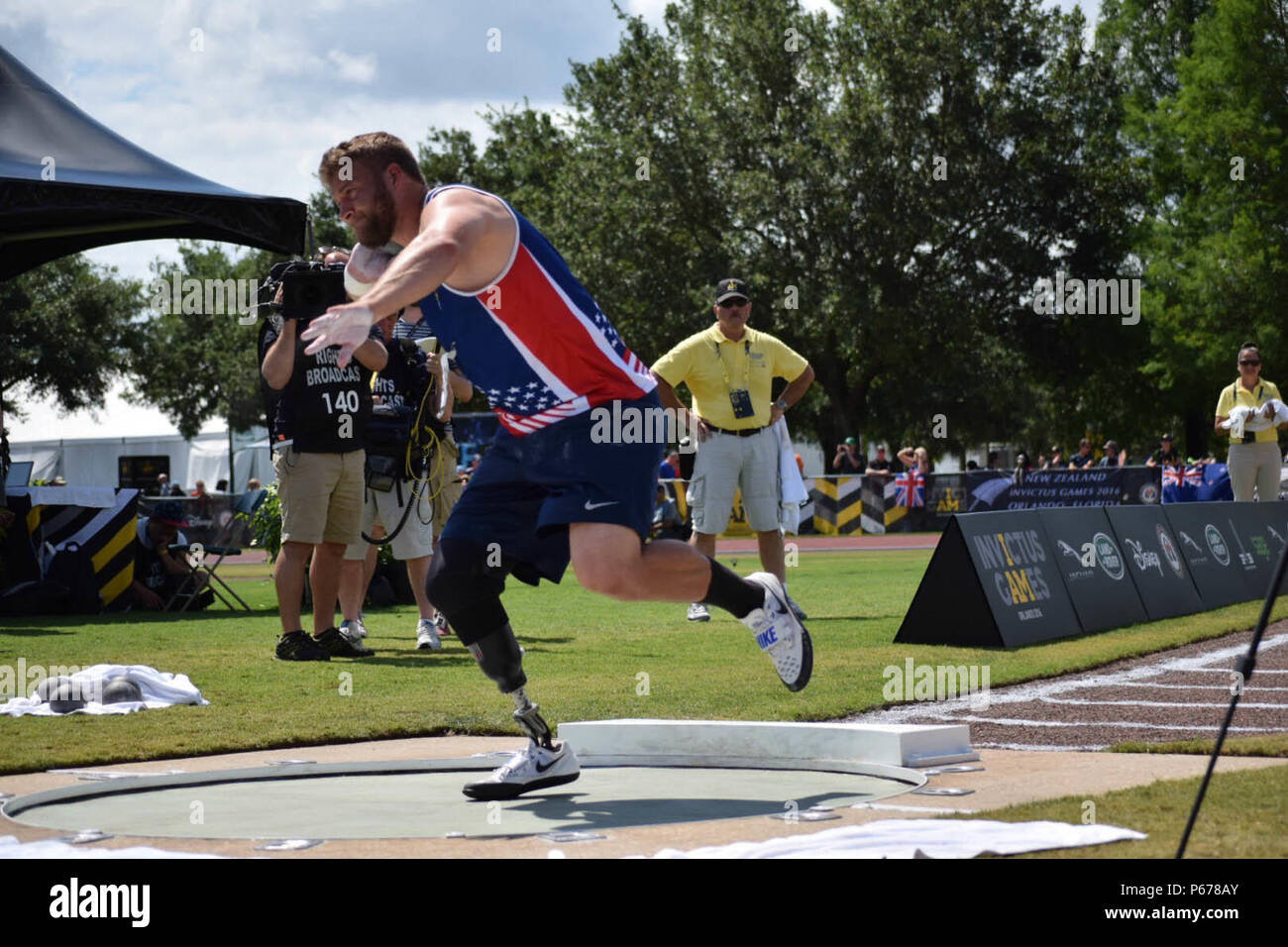 Navy Hospital Corpsman 2nd Class (Ret.) Max Rohn launches the shot put ...