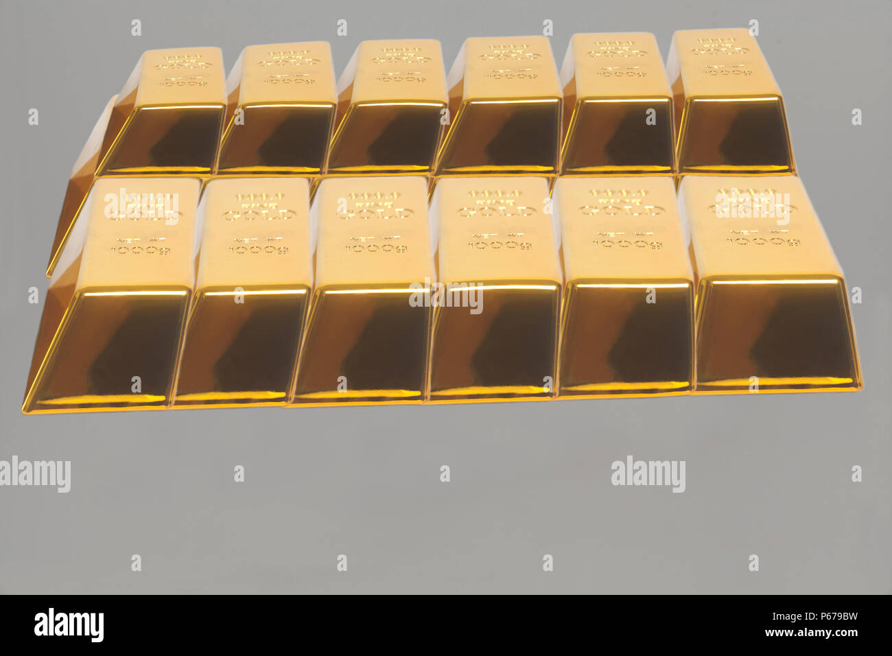 Stacked bars of gold bullion on a gray background.Financial concept ...