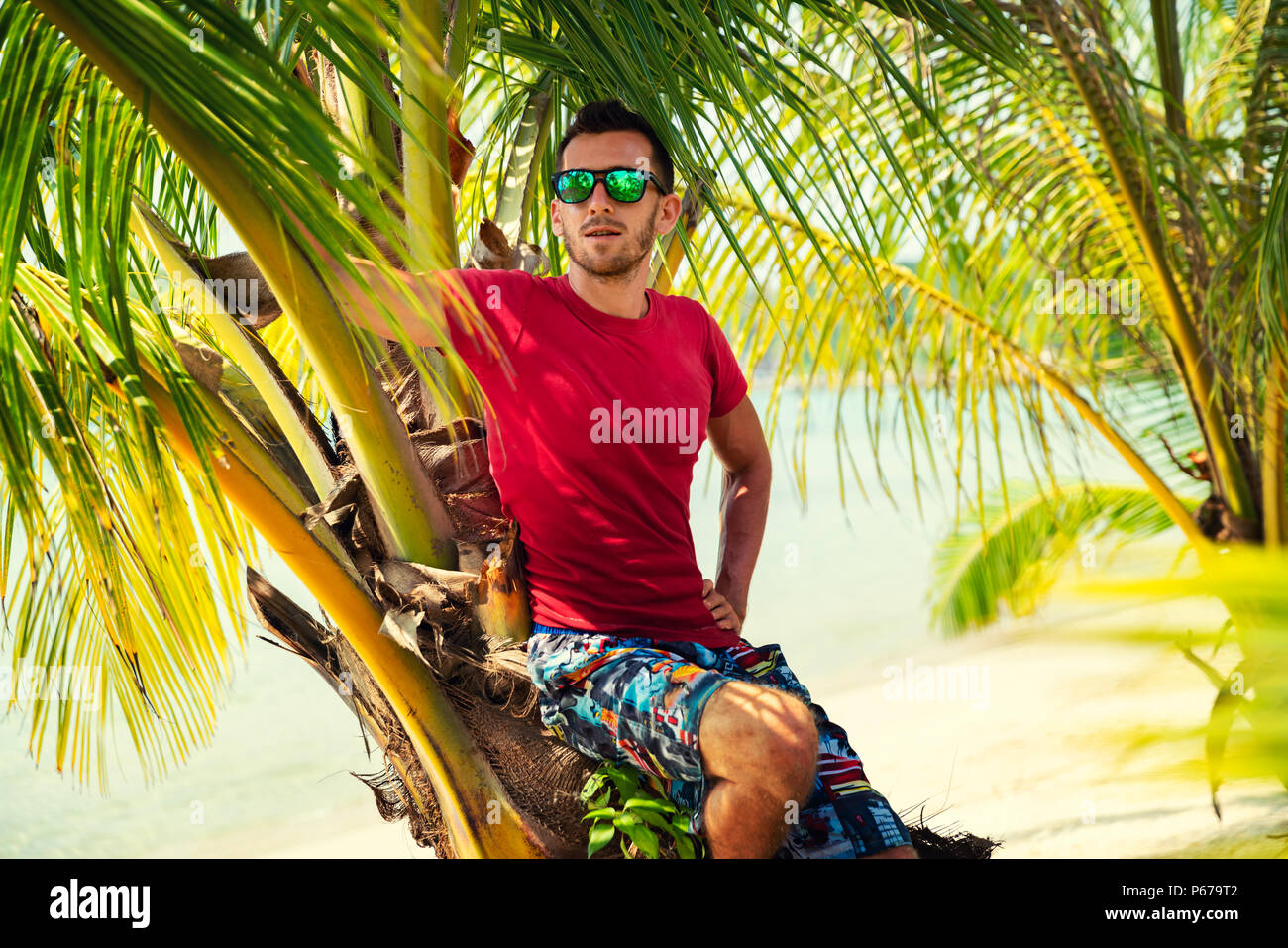 Summer Travel Vacation. Handsome Man in sunglasses sunbathing at ...