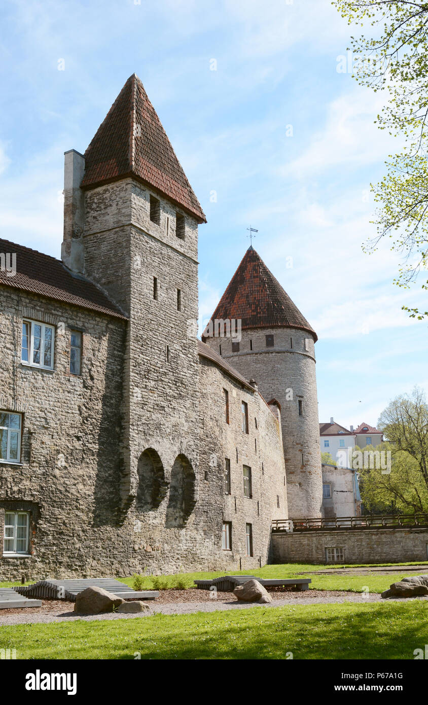 Round and square towers with tiled roofs in the medieval town wall in ...