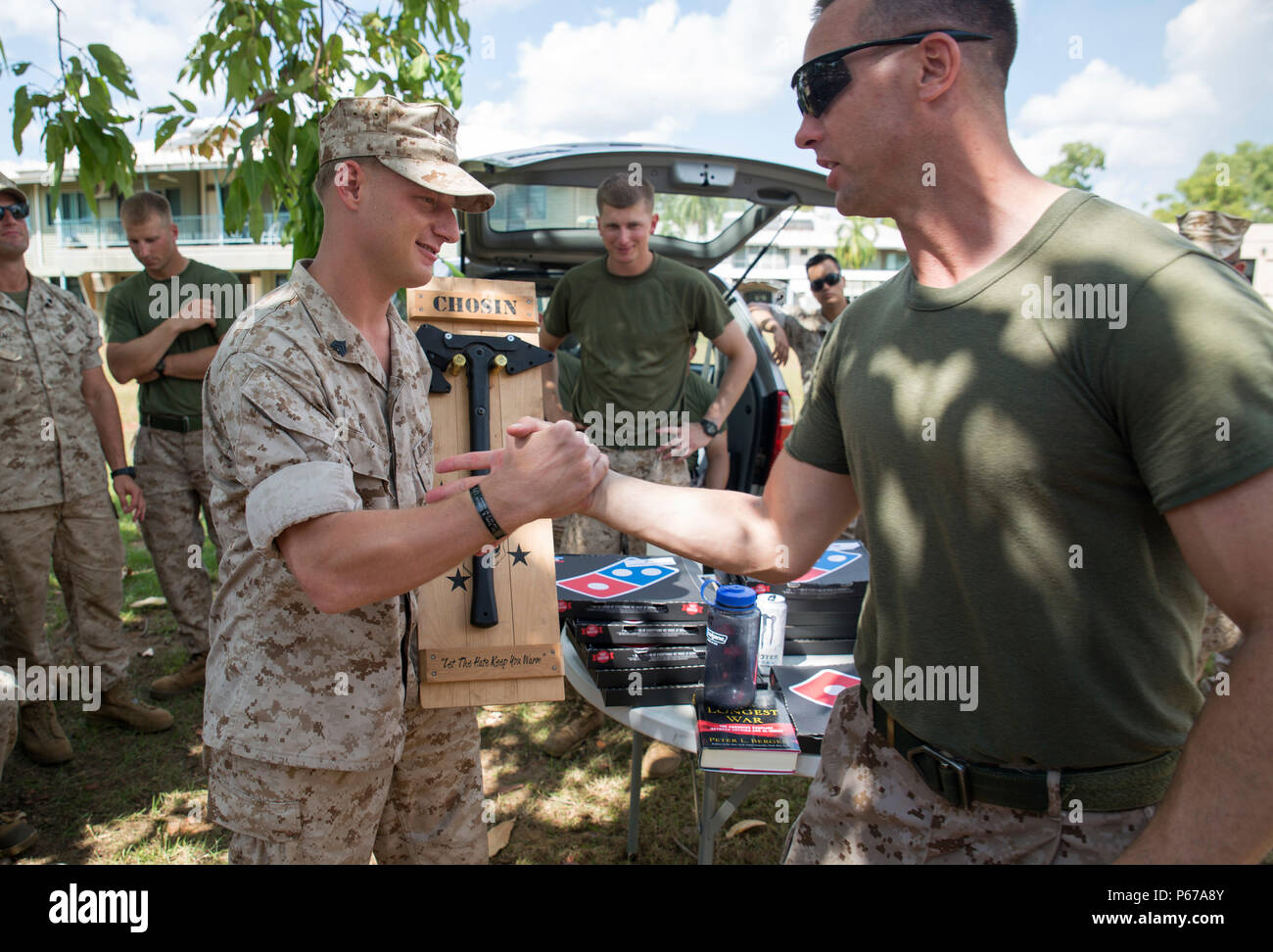 Maj. Christopher Simpson, Company C Commander, hands Sgt. James T ...