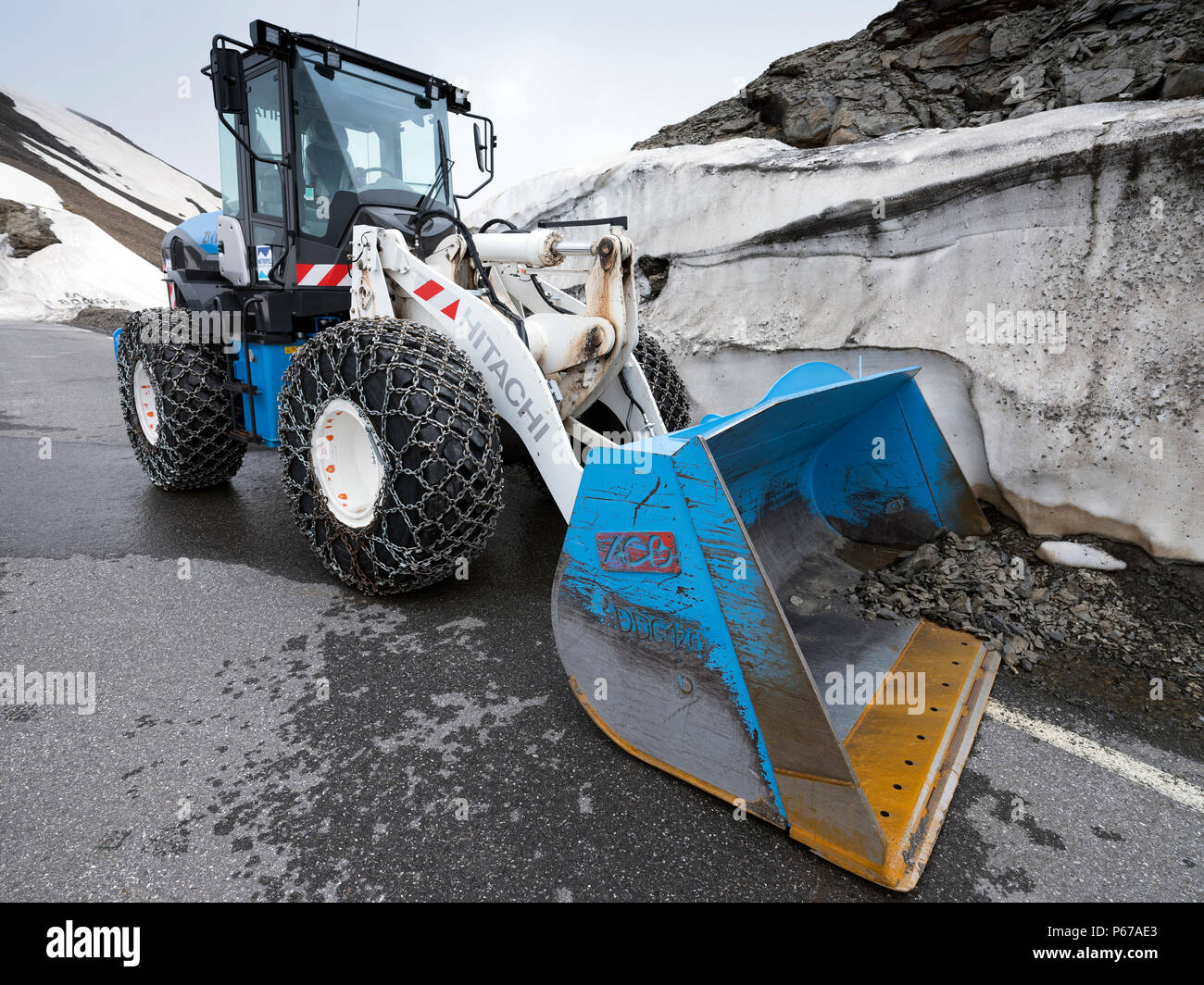 bulldozer with snow chains on col de la bonnette high in the alps of ...