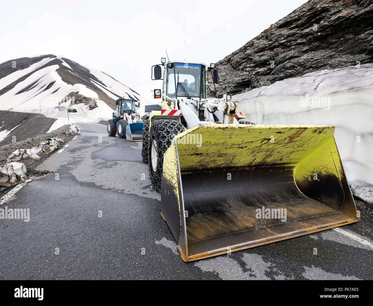 bulldozer with snow chains on col de la bonnette high in the alps of ...