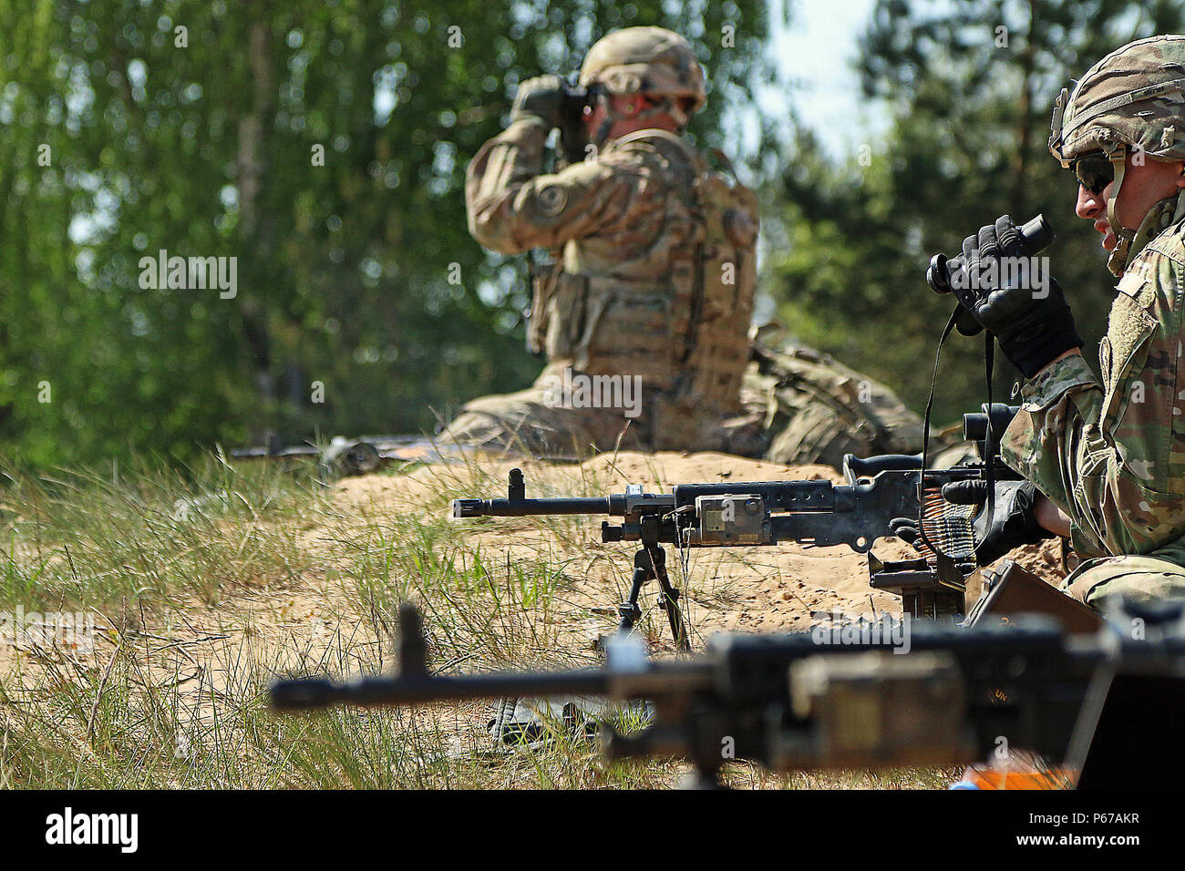 Peeking through binoculars, spotters view pop-up targets and tell ...