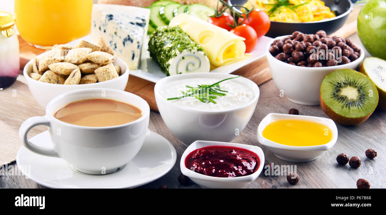 Breakfast served with coffee, orange juice, cheese, cereals and ...