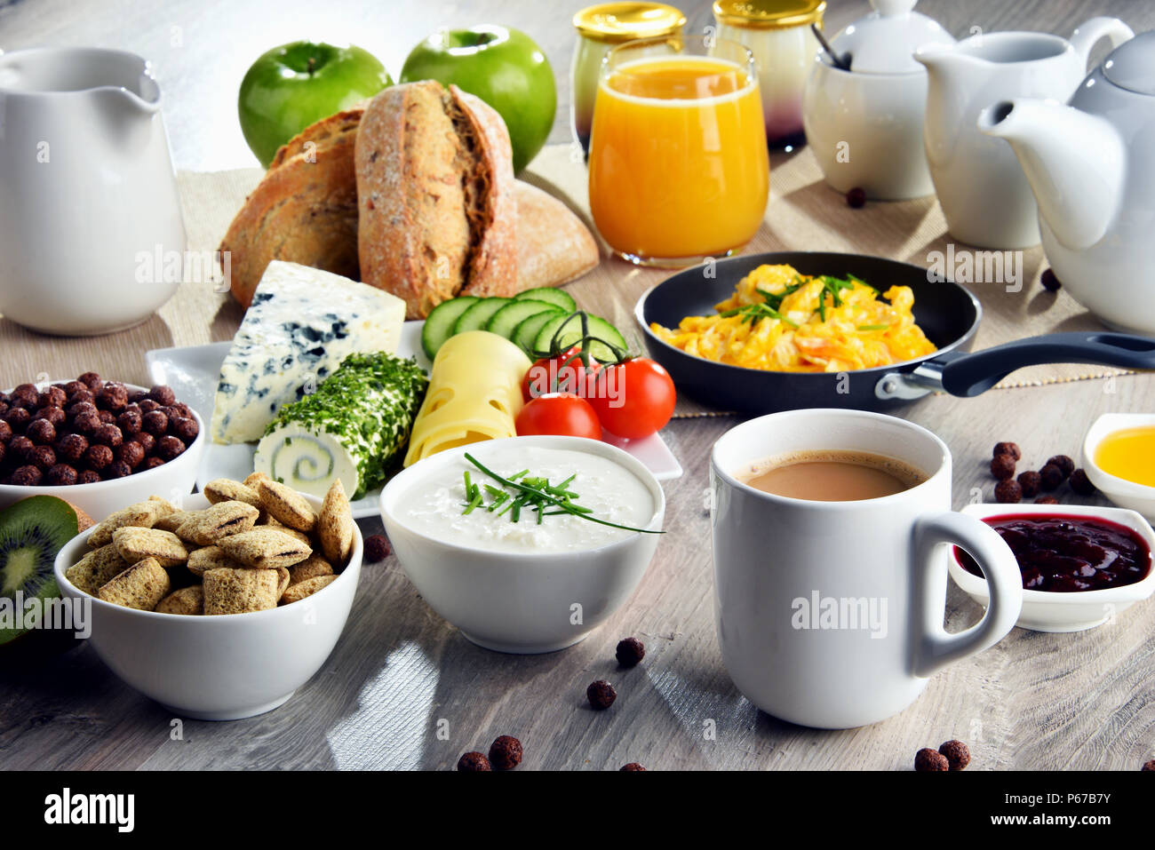 Breakfast served with coffee, orange juice, cheese, cereals and ...