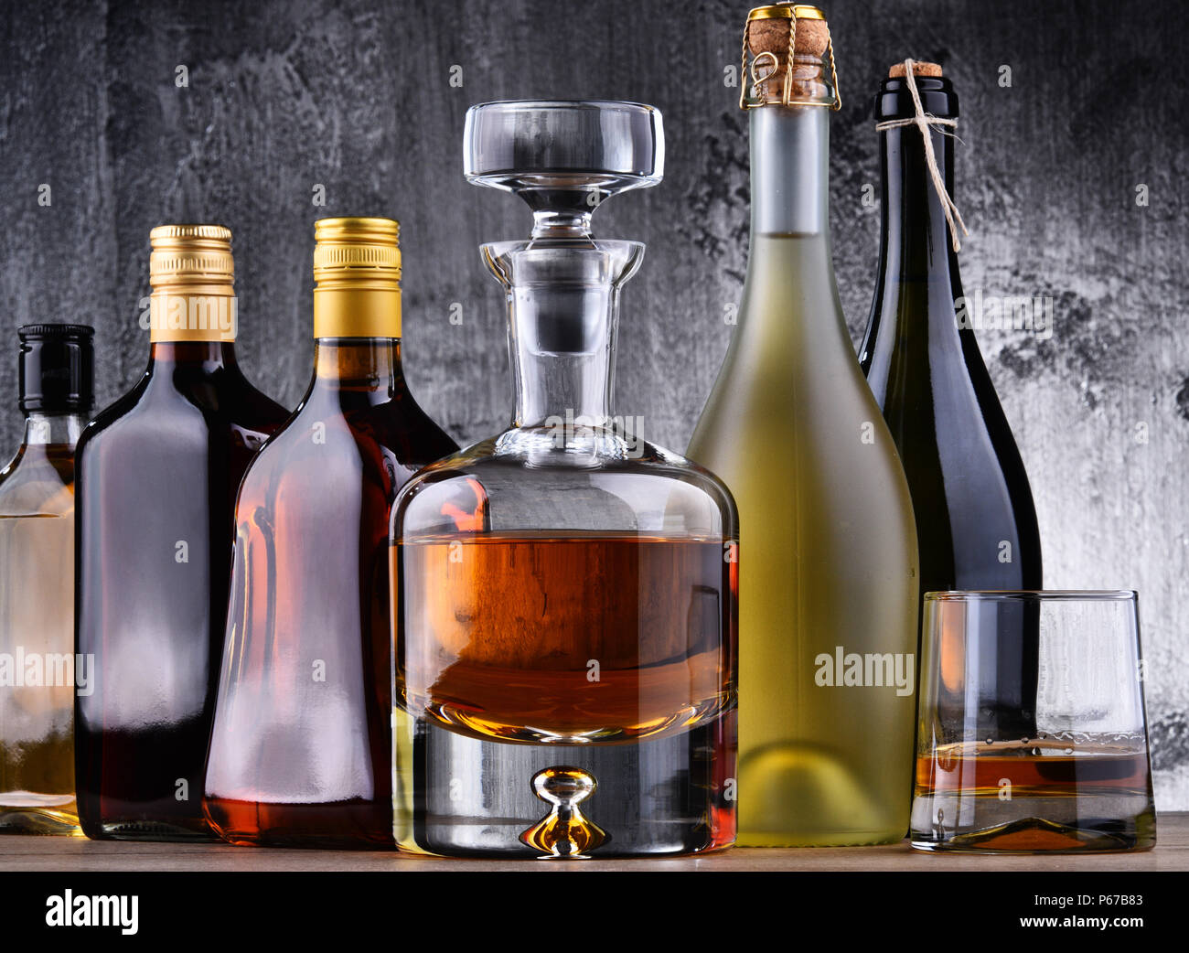 Composition with carafe and bottles of assorted alcoholic beverages ...