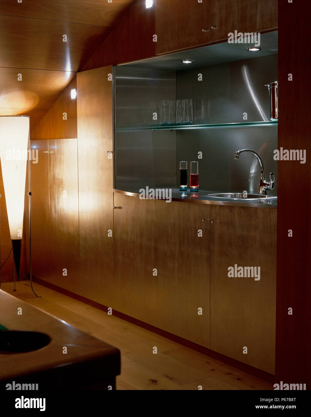 View of a large wooden unit fitted with a sink Stock Photo - Alamy