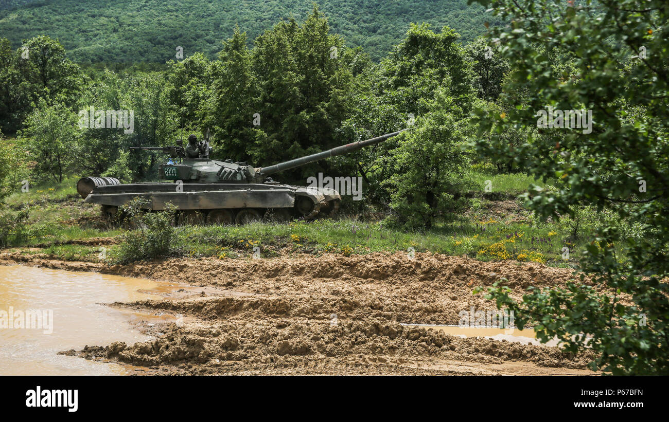 A Bulgarian T-72 tank holds its position before advancing during ...