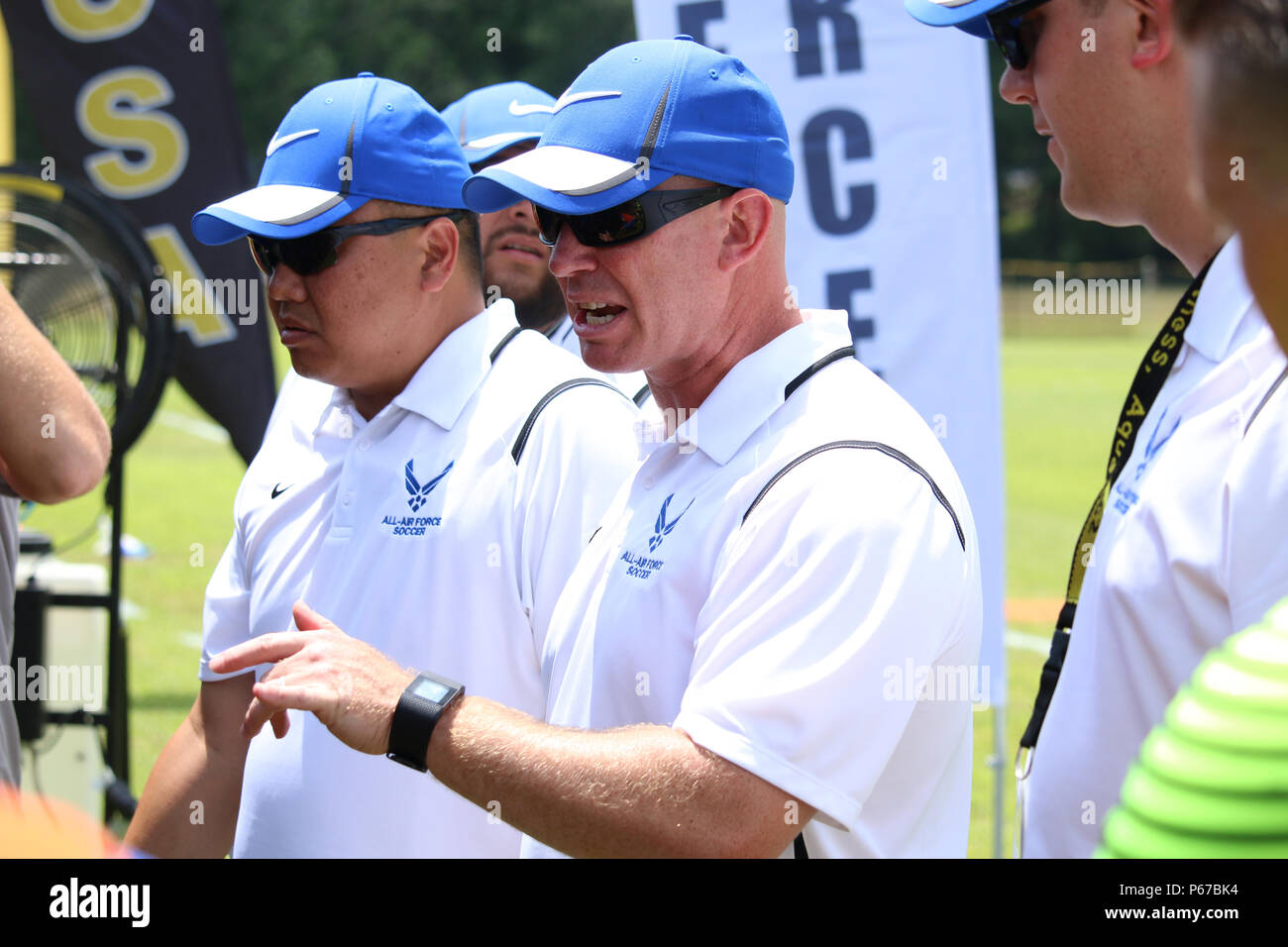 Air Force Head Coach Lt Col. Derrick Weyand (center) gives instructions ...