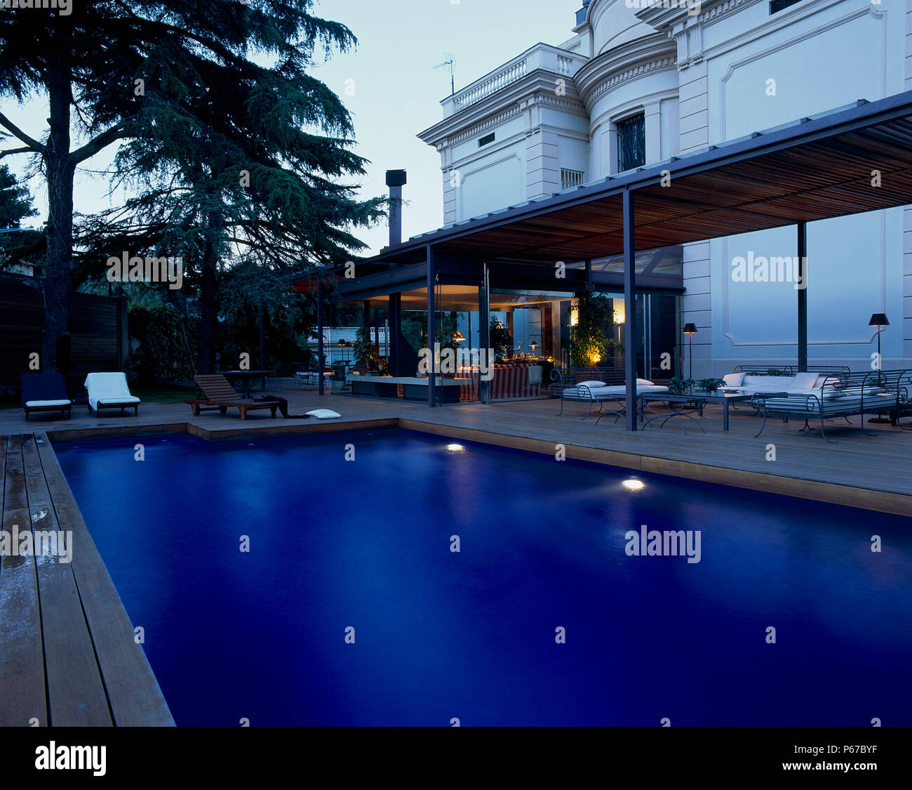 View of a swimming pool at a vacation resort Stock Photo - Alamy