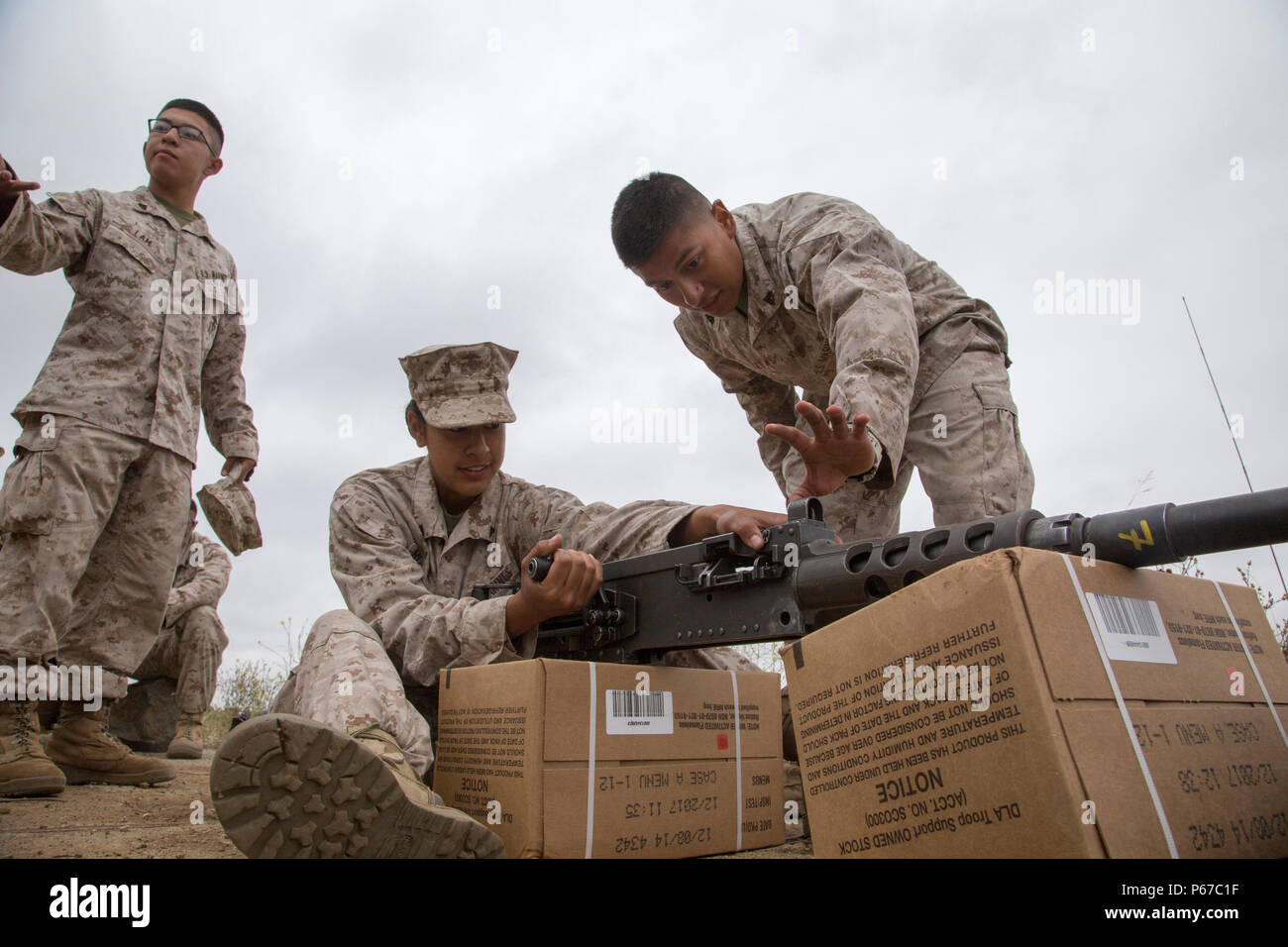 Lance Cpl. Natalie N. Rodriguez and Cpl. Denny Gonzalez prepare an M2 ...