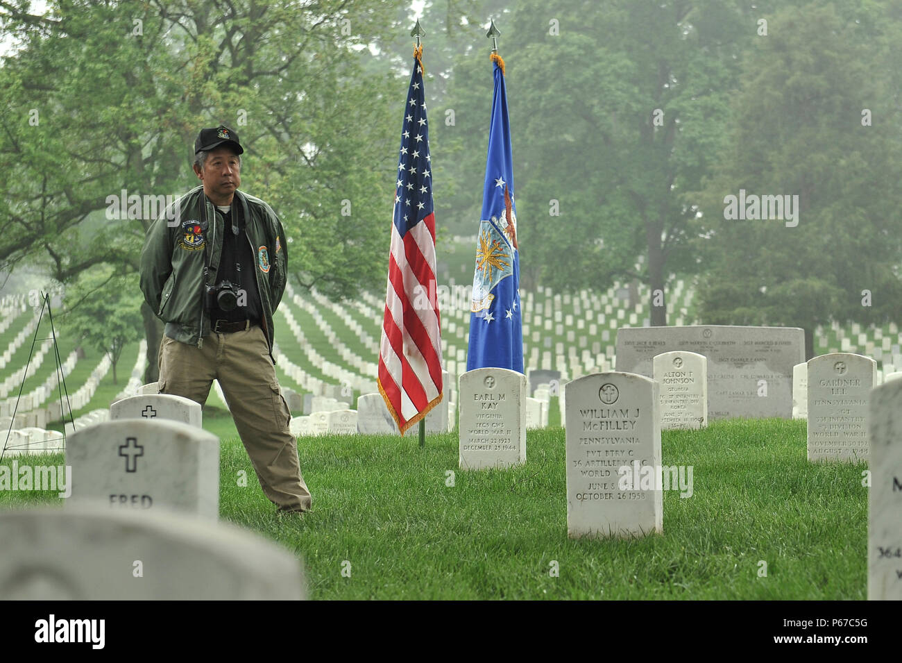 Retired Staff Sgt. Richard Yeh renders stands as he listens to a speech ...