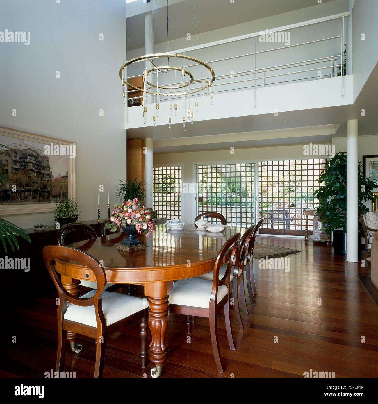 View of an elegant wooden dining table Stock Photo - Alamy