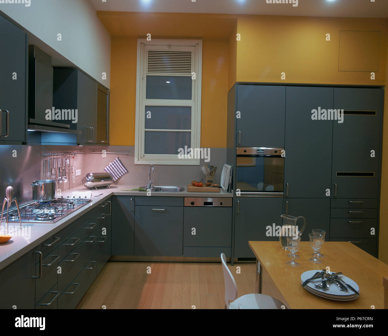 View of an illuminated kitchen Stock Photo - Alamy