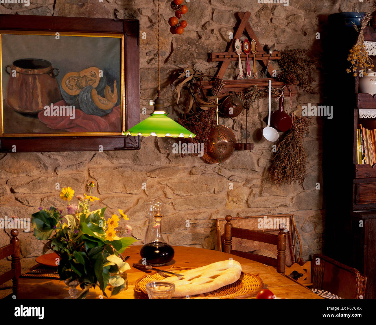 View of an illuminated lamp over a dining table Stock Photo - Alamy