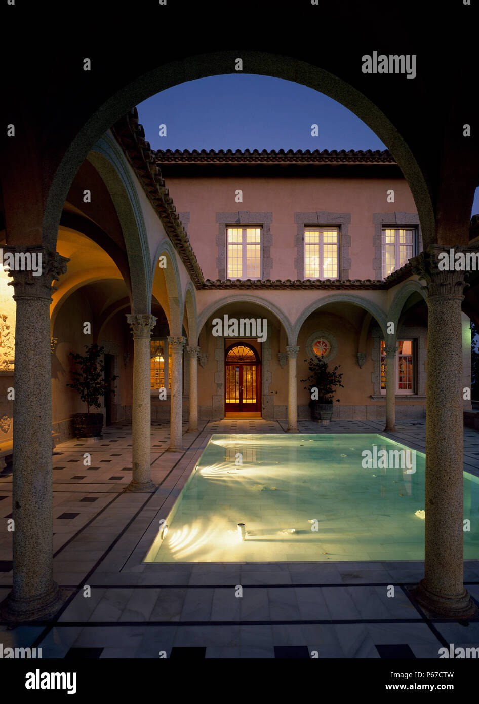 View of an illuminated swimming pool at dusk Stock Photo - Alamy