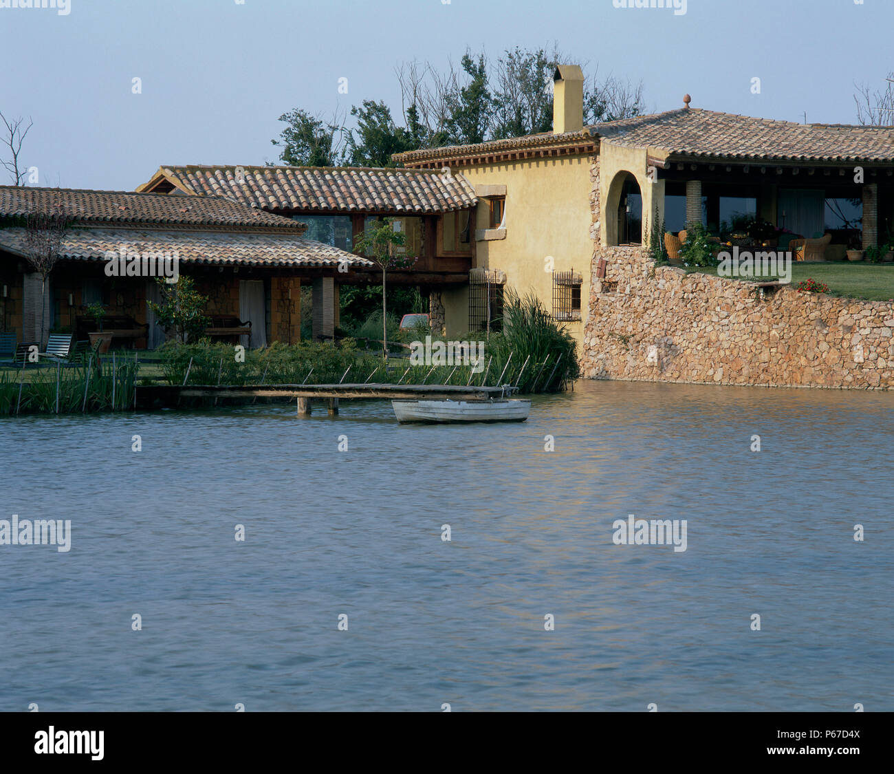View of houses alongside a river Stock Photo - Alamy