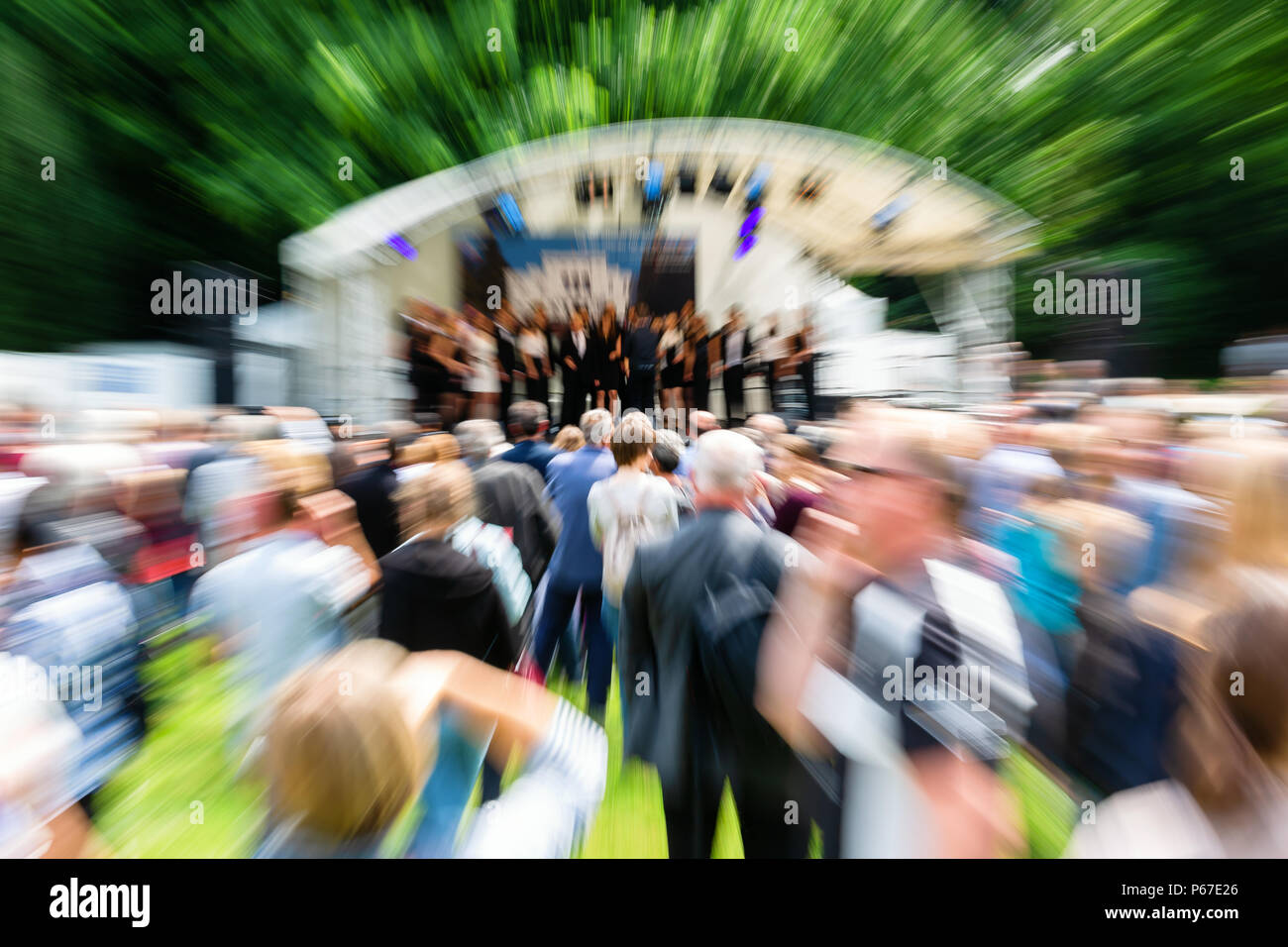picture with camera made zoom effect of a crowd of spectators on an ...