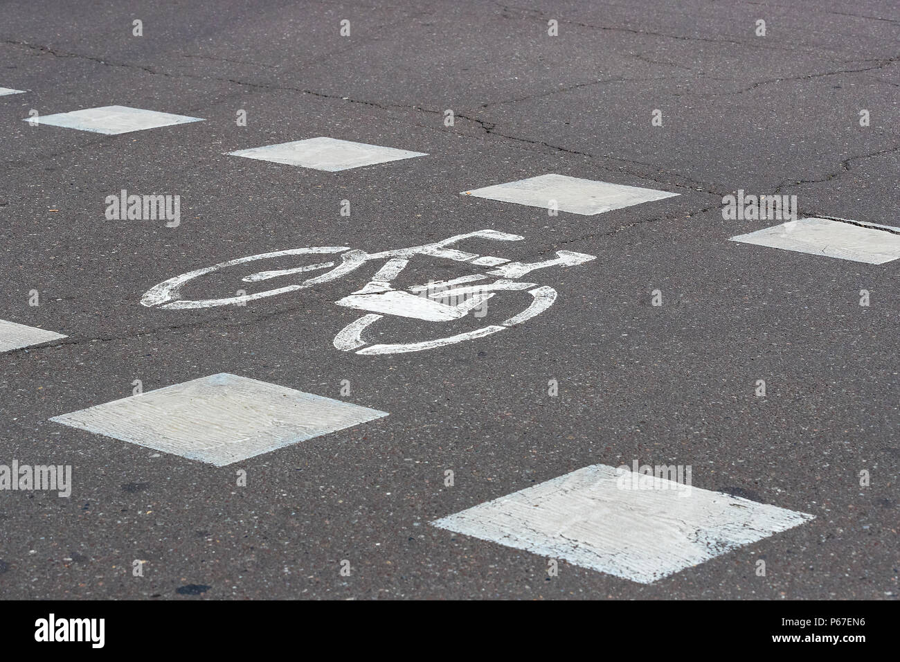 Marking on the bike lane and traffic signs Stock Photo - Alamy