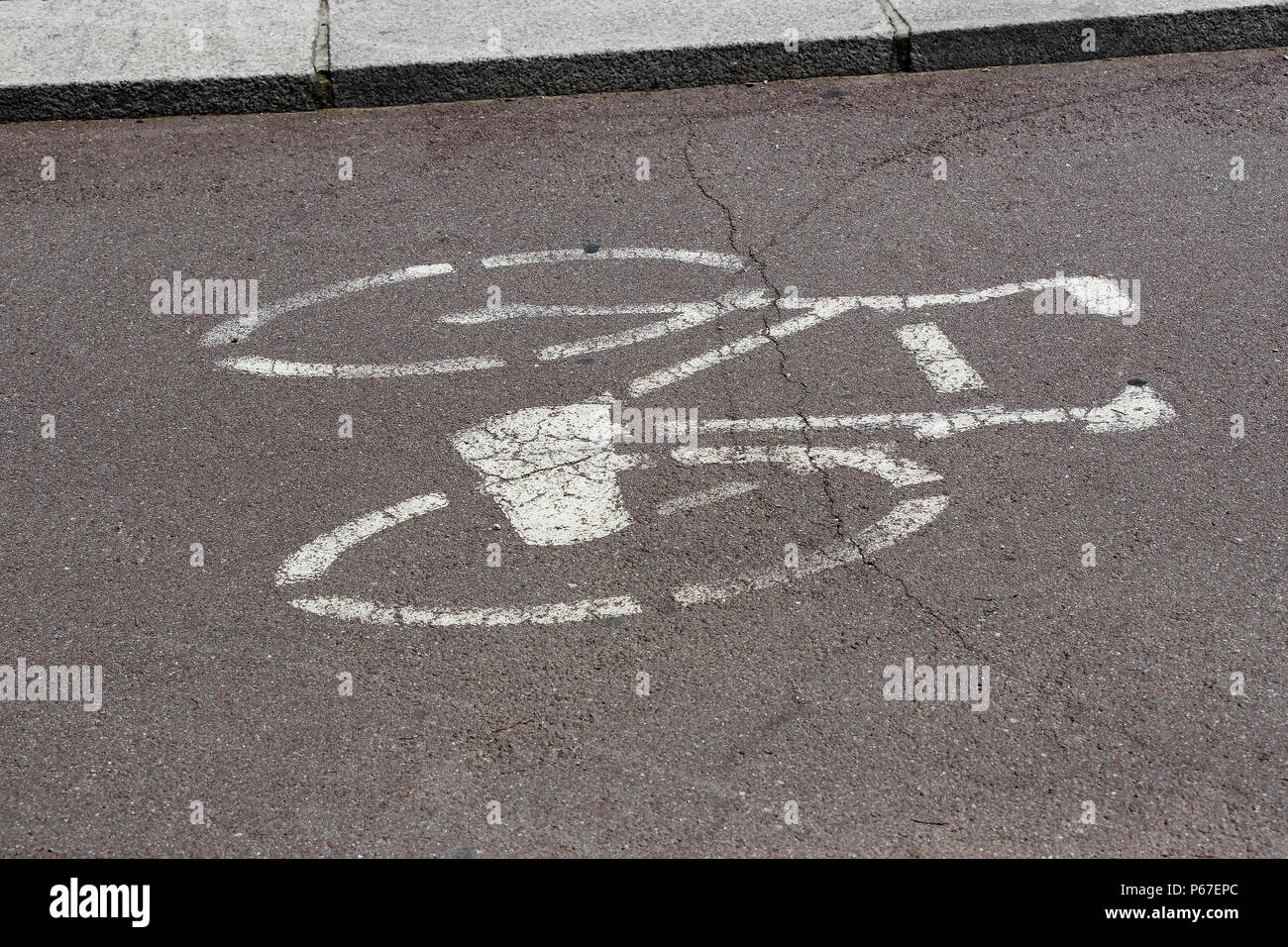 Marking on the bike lane and traffic signs Stock Photo - Alamy