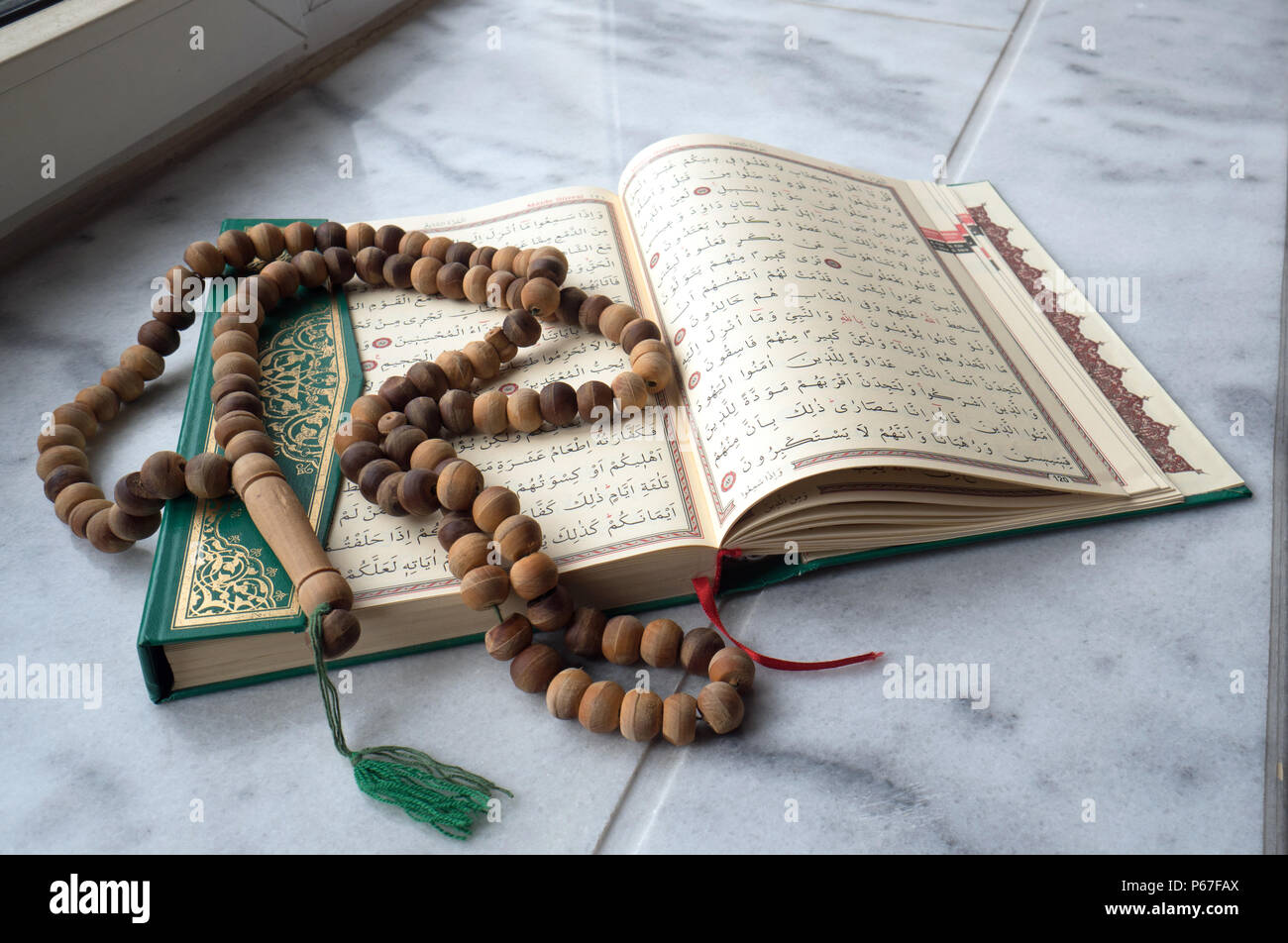 custom printed Holy Quran and kuka tree handmade beads Stock Photo - Alamy