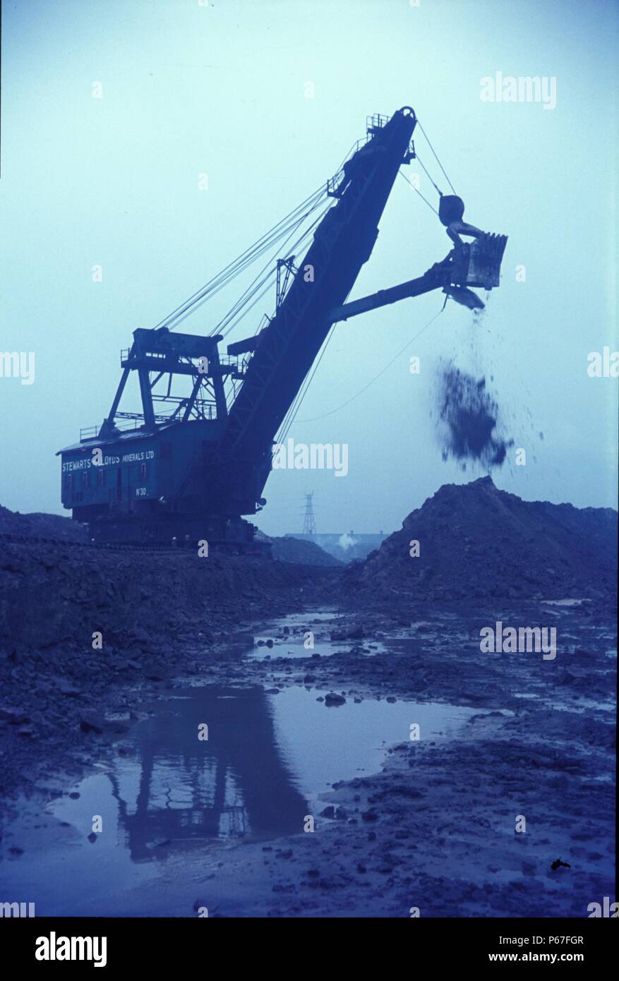 Digger at work on the mines which surrounded the vast Corby Steelworks ...
