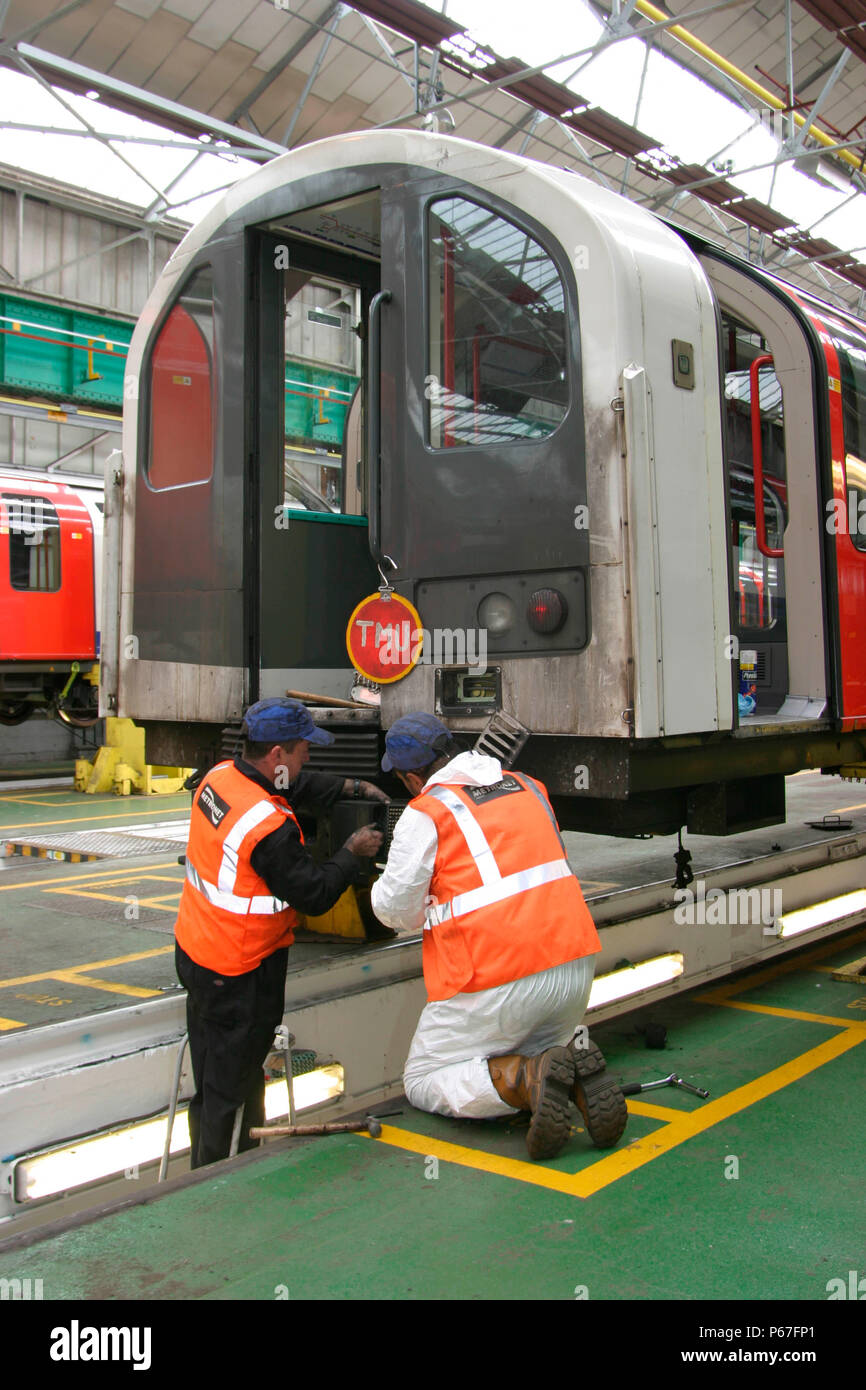 Engineers carry out refurbishment work on London Underground stock at ...