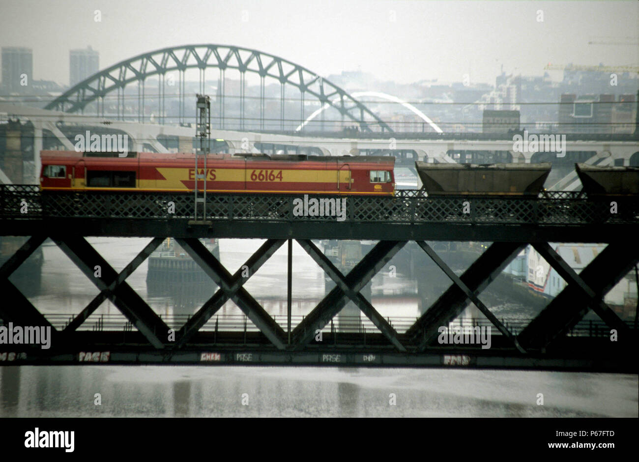EWS locomotive number 66164 hauls coal wagons across Newcastle's King ...