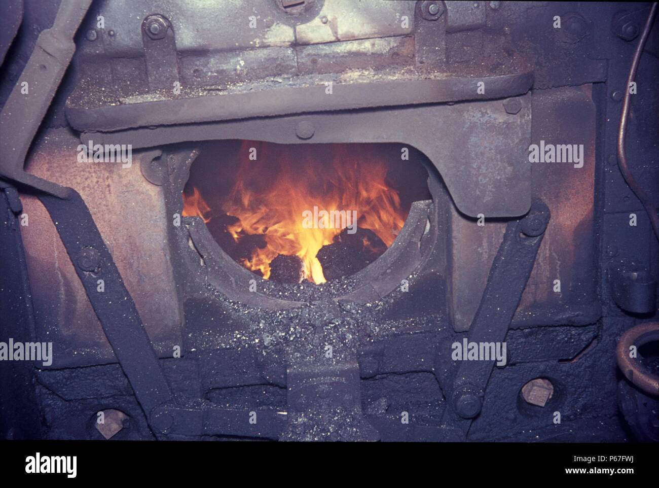 Firehole door in cab of steam locomotive Stock Photo - Alamy