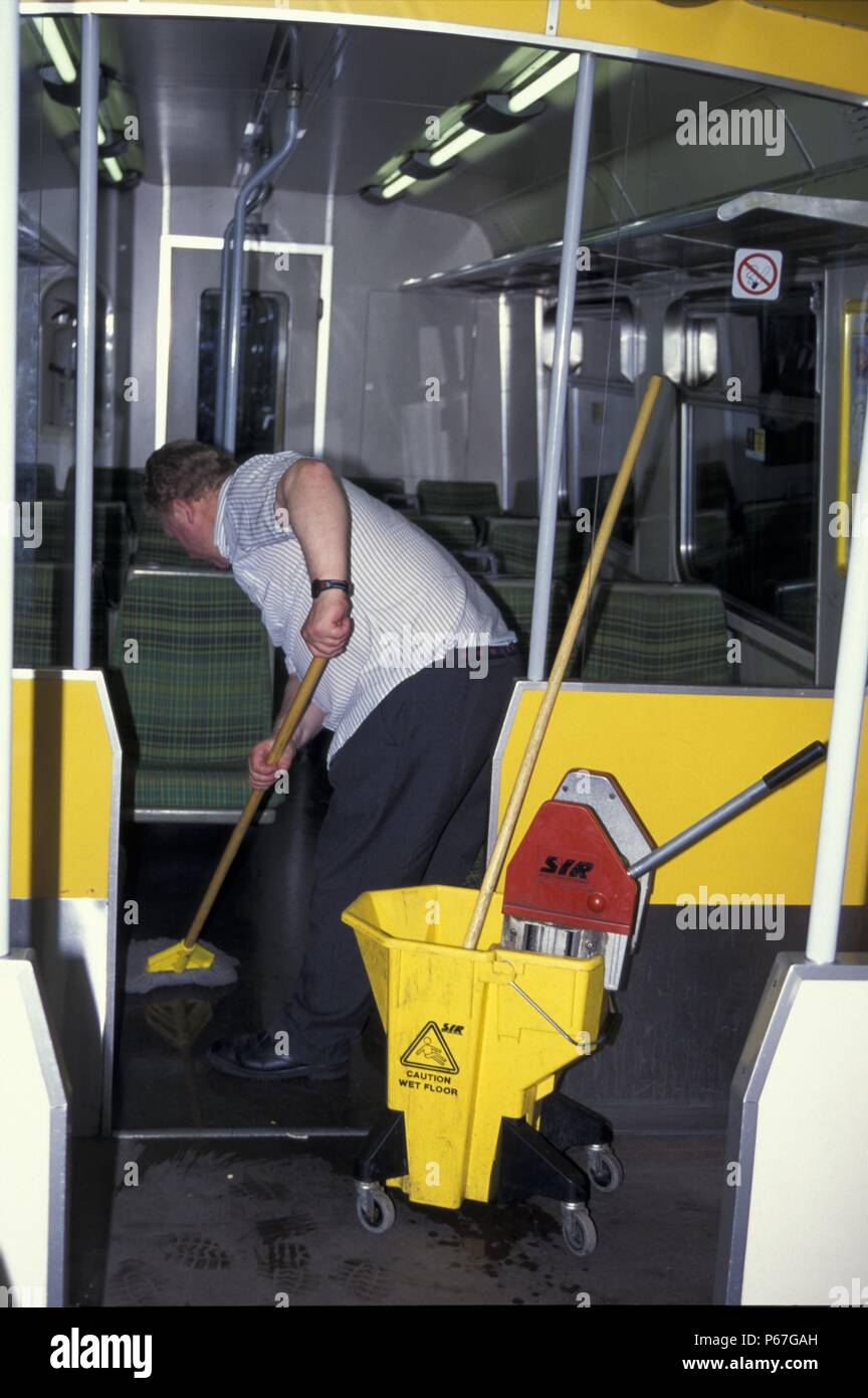 Internal train cleaning at Birkenhead Central. May 1995 Stock Photo - Alamy