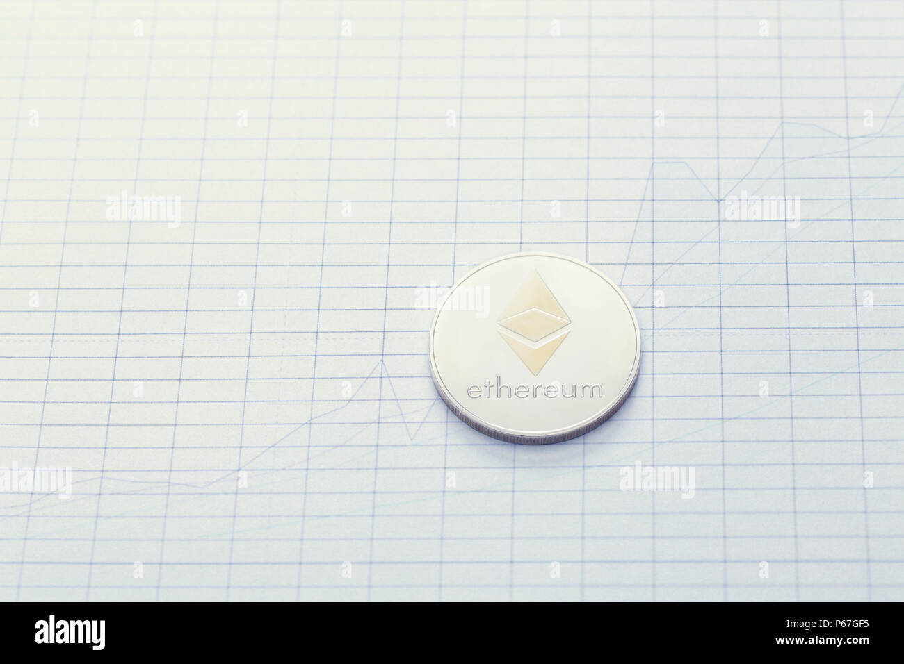 Price of Ethereum coin concept with silver coin laid on chart showing ...
