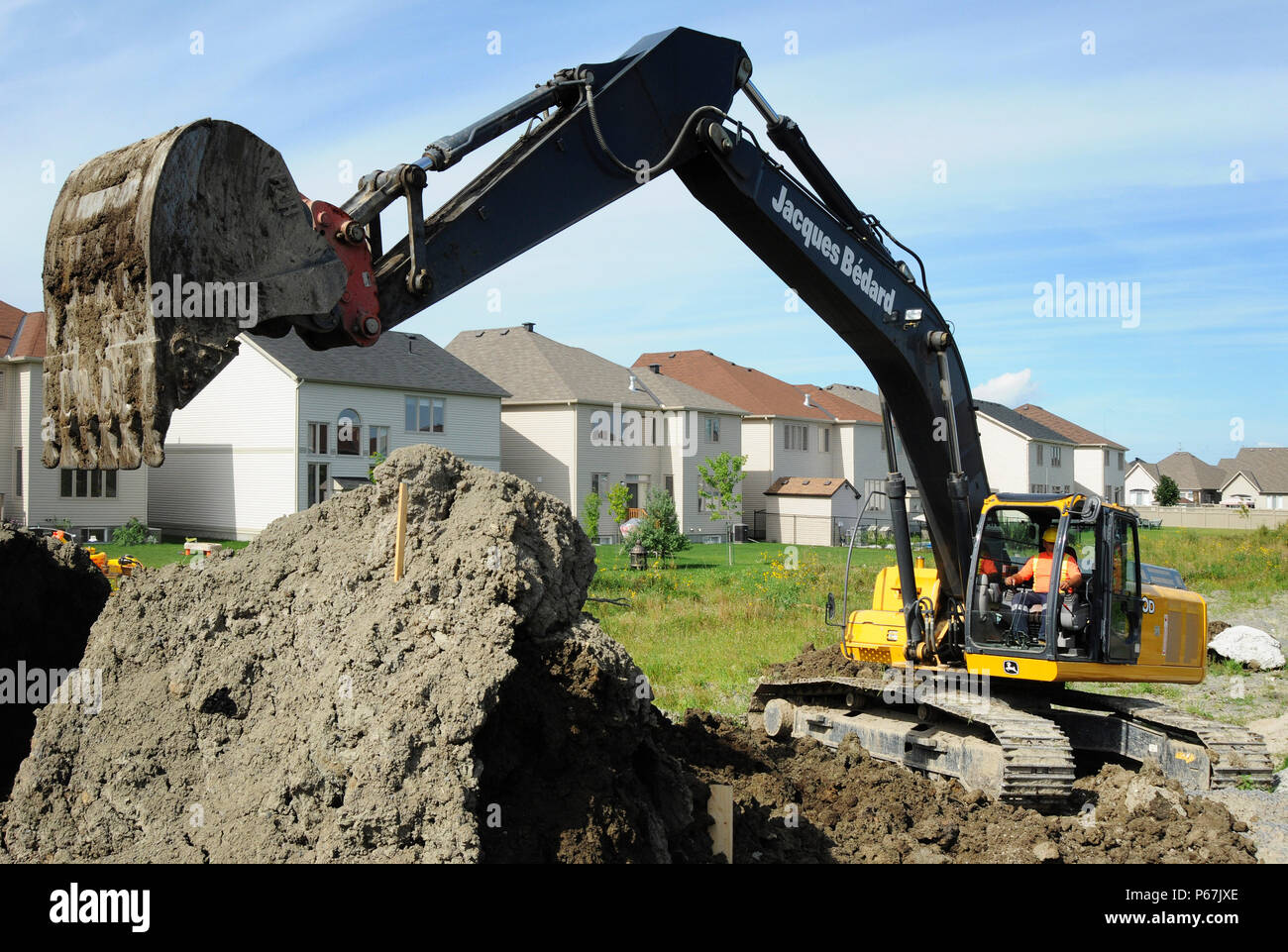 Excavator, digging at residential development, in progress, Ottawa ...