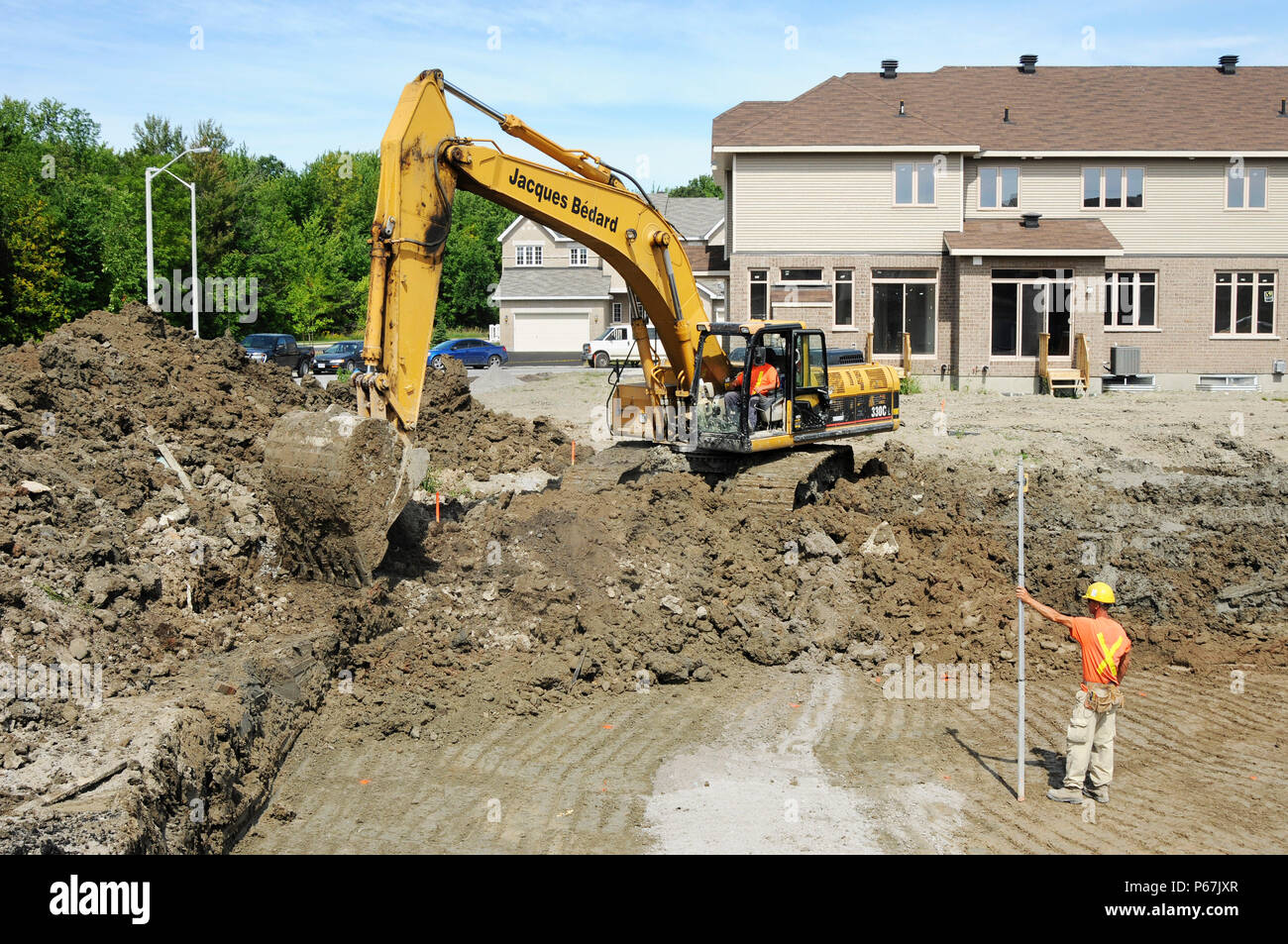 Excavator, digging at residential development, in progress, Ottawa ...