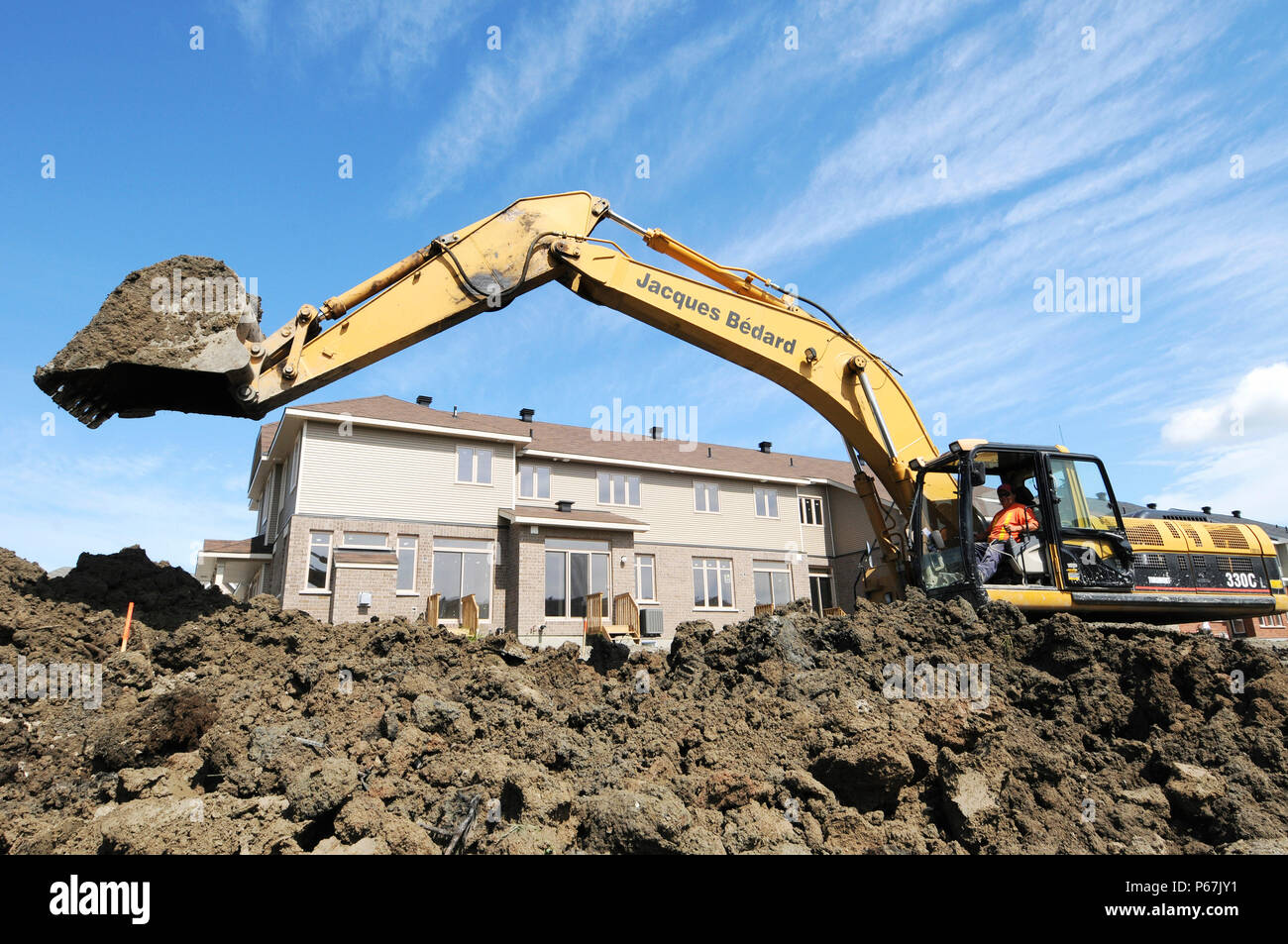 Excavator, digging at residential development, in progress, Ottawa ...