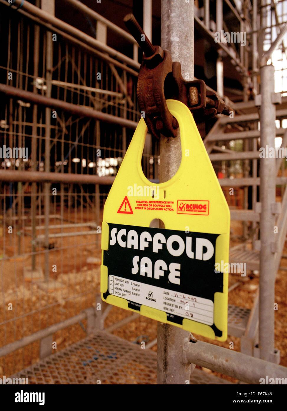 Safety sign attached on a scaffold Stock Photo - Alamy