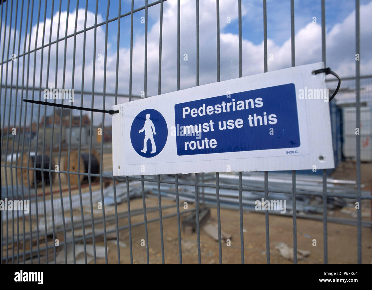 detail of pedestrian sign on metal site fencing Stock Photo - Alamy