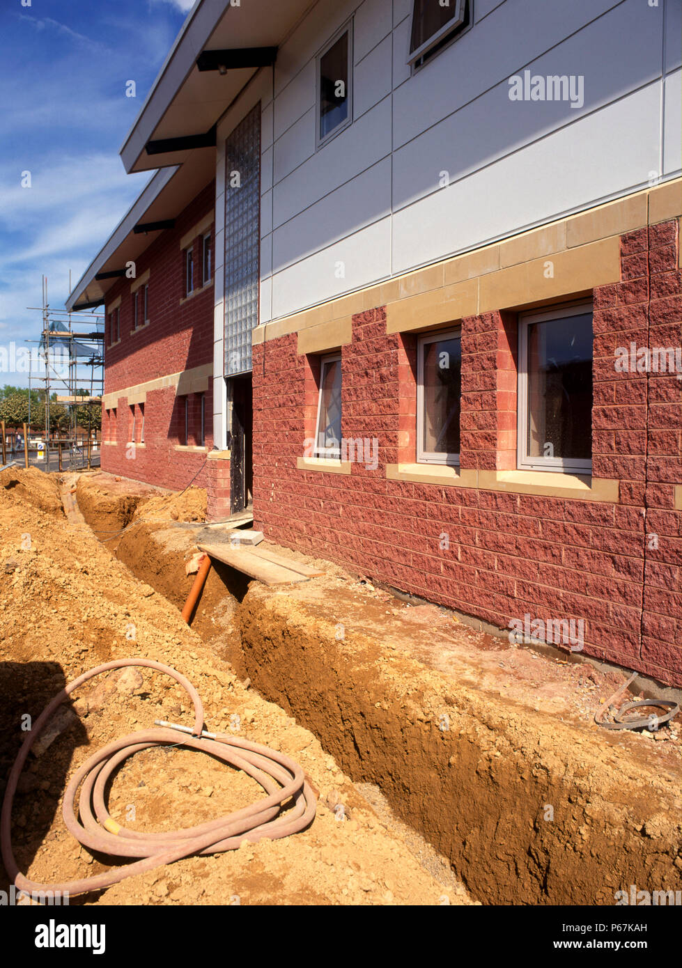 Gas trench on a side of a new office block Stock Photo - Alamy