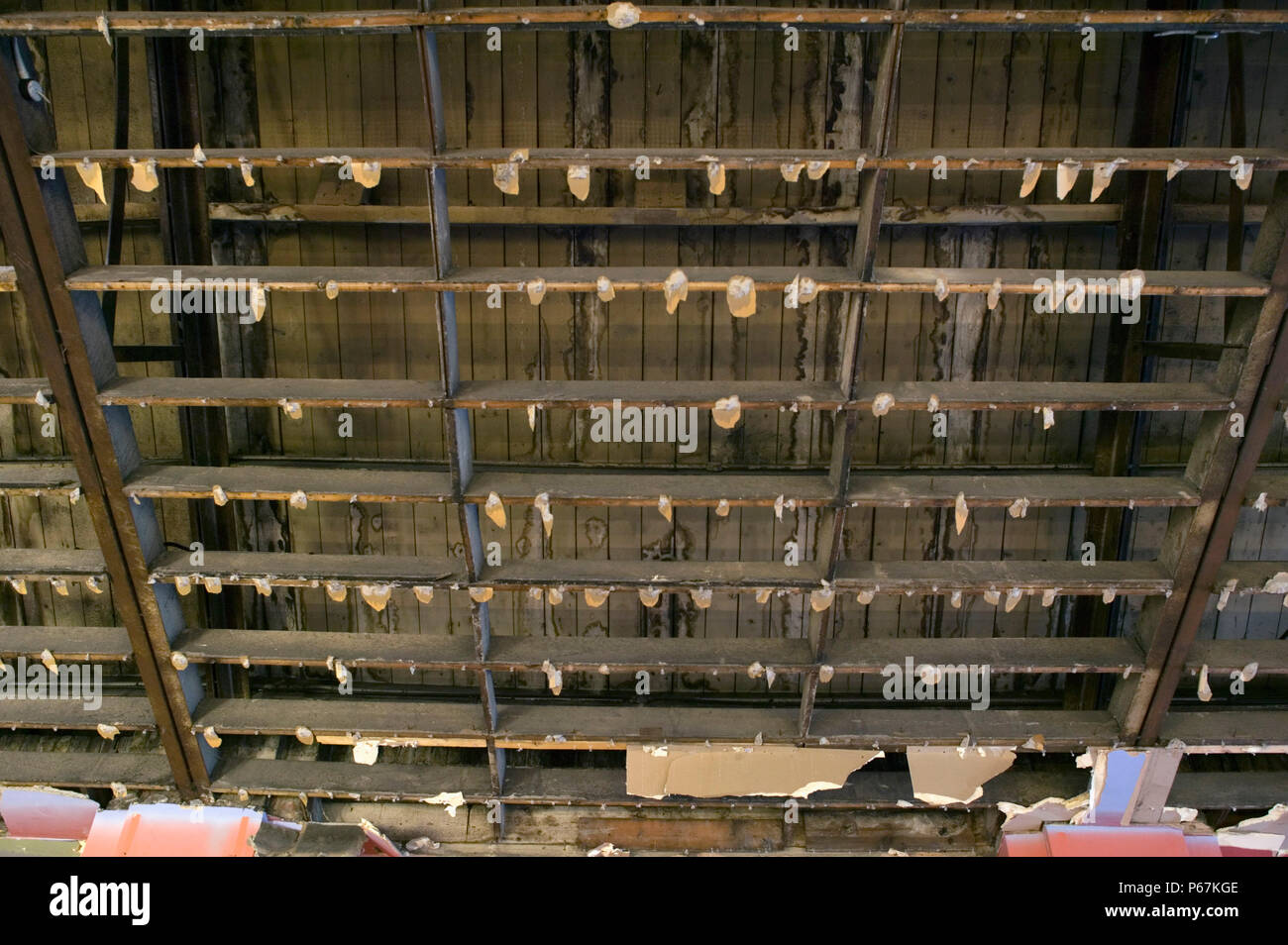 Ceiling being demolished with plasterboard sheets and rafters Stock ...