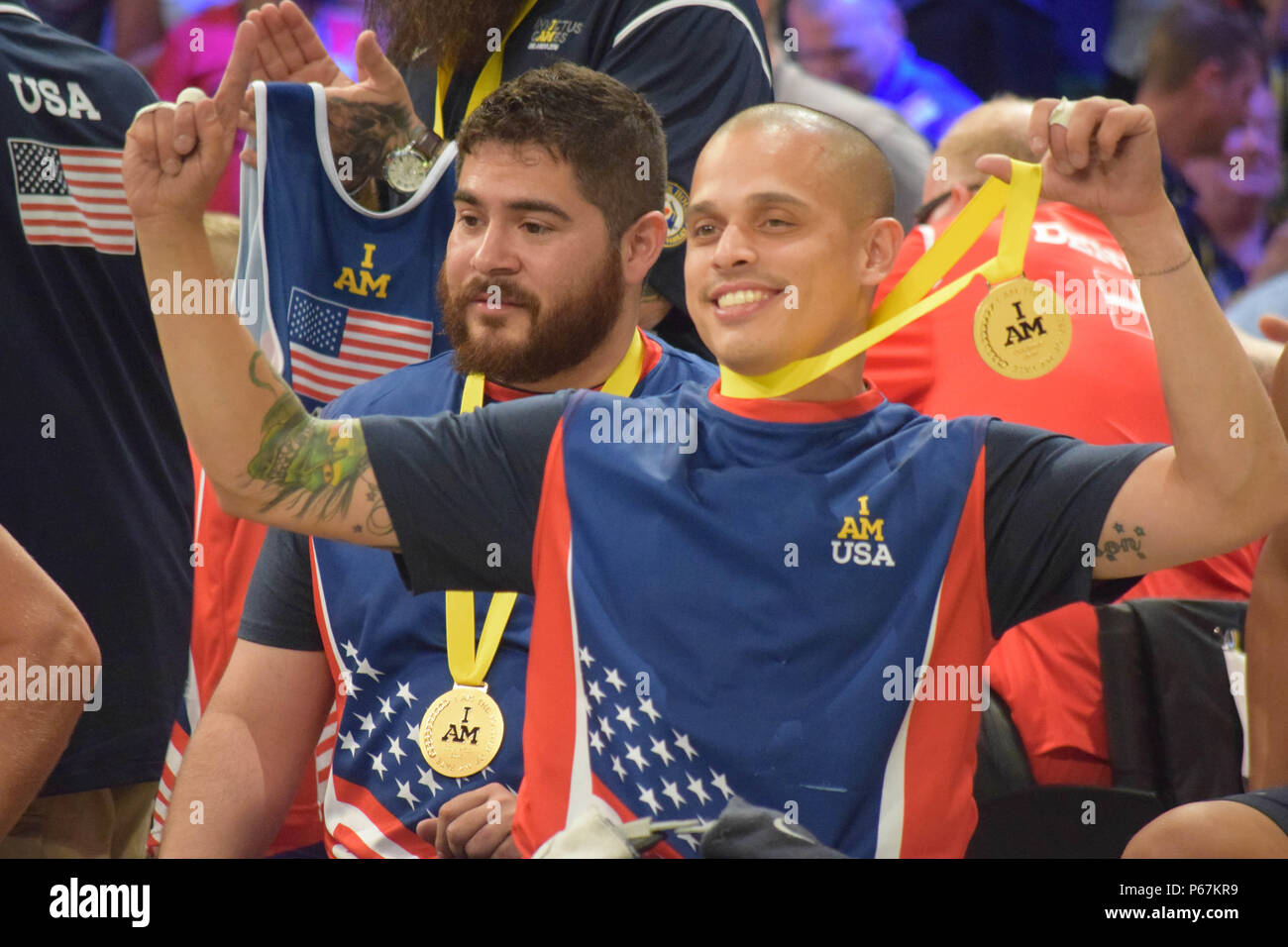 Navy Fire Controlman 3rd Class (ret.) Jason Reyes celebrates after ...