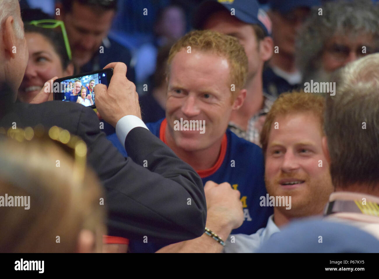 Navy Lt. John Edmonston (ret.) poses for a photo taken by Prince Harry ...