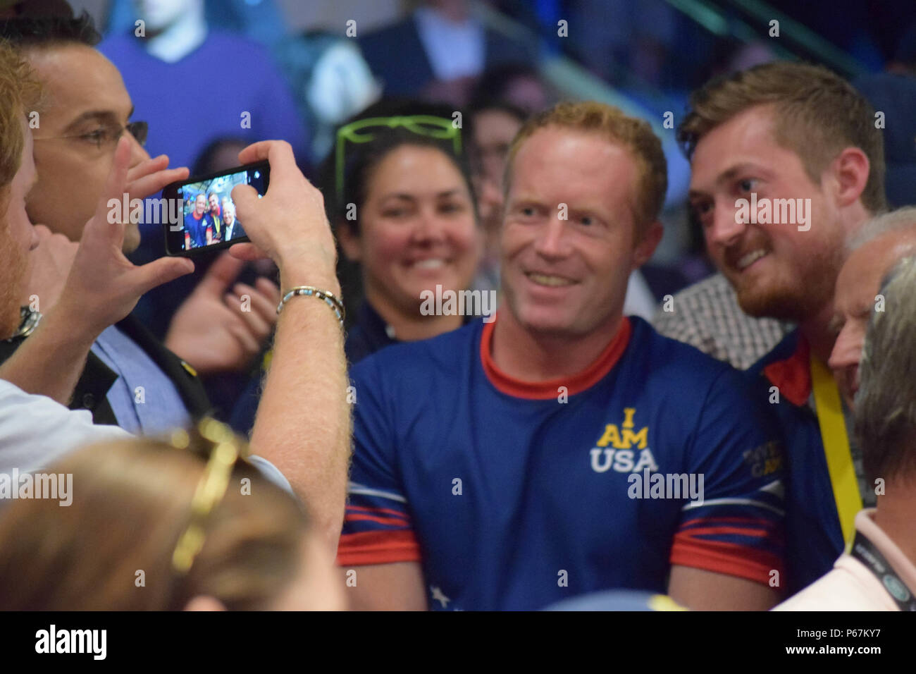 Navy Lt. John Edmonston (ret.) poses for a photo taken by Prince Harry ...