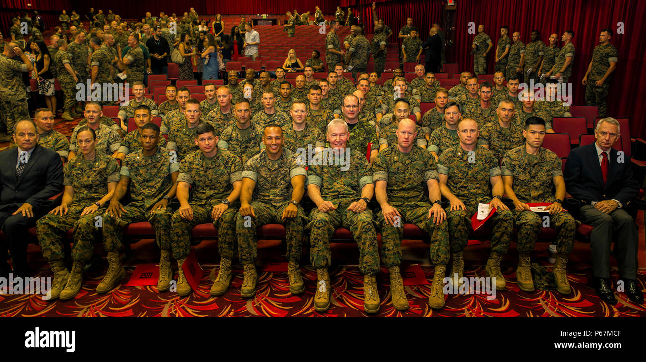 Lt. Gen. John A. Toolan sits with the new graduates at the College of ...