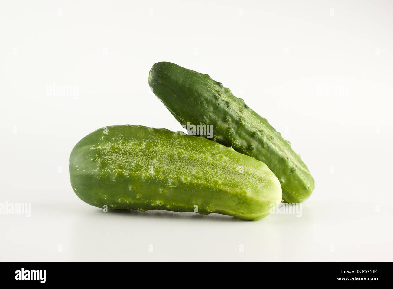 fresh green cucumber isolated on white background Stock Photo - Alamy