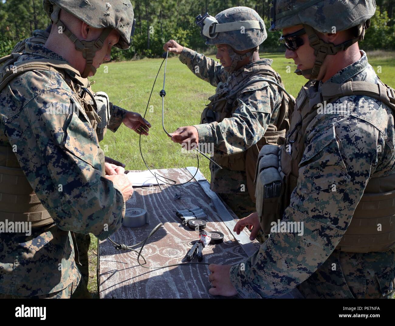 Marines with 2nd Combat Engineer Battalion build charges to detonate ...